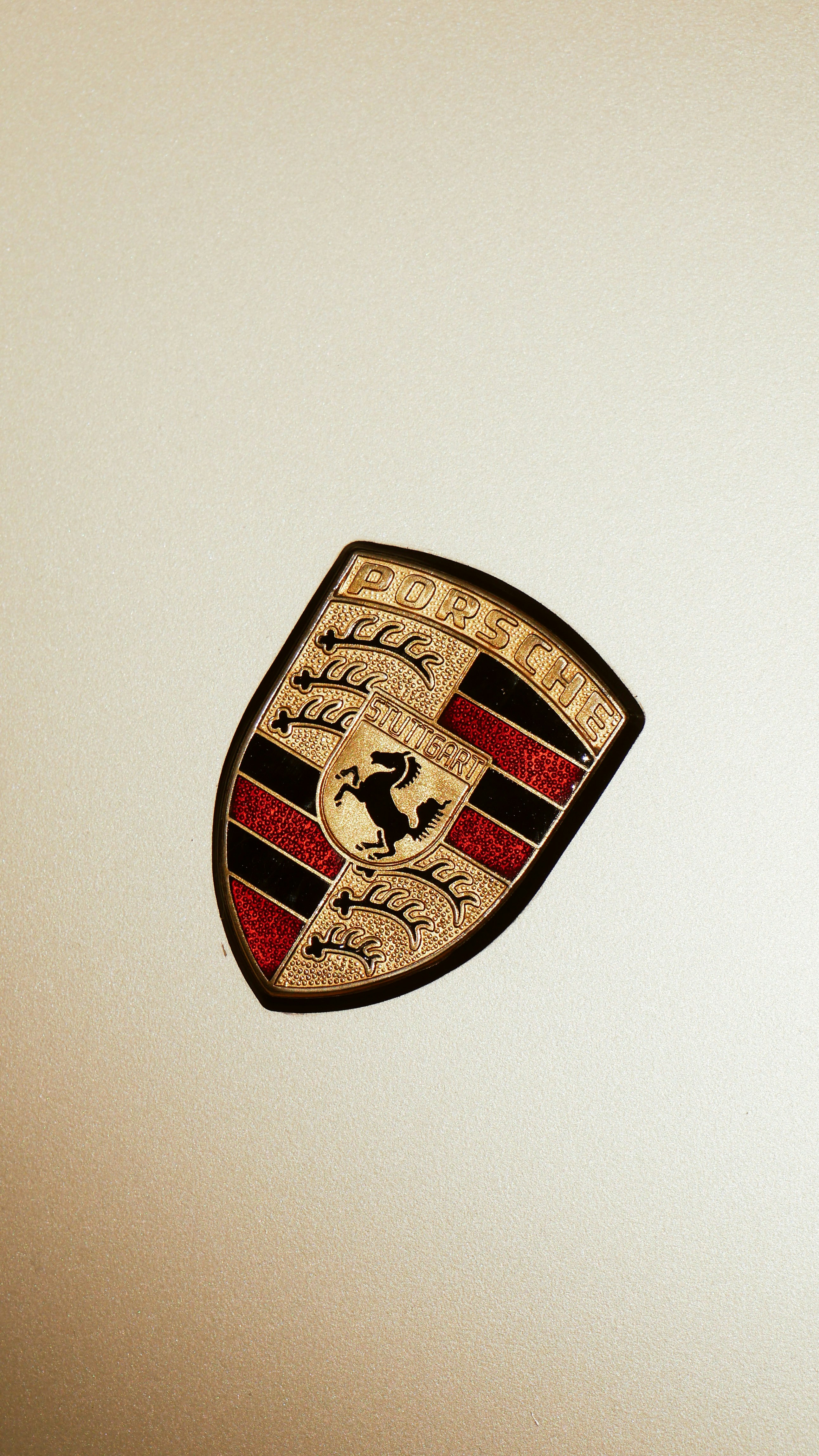 A close up of a badge on a car photo – Free Stuttgart Image on Unsplash