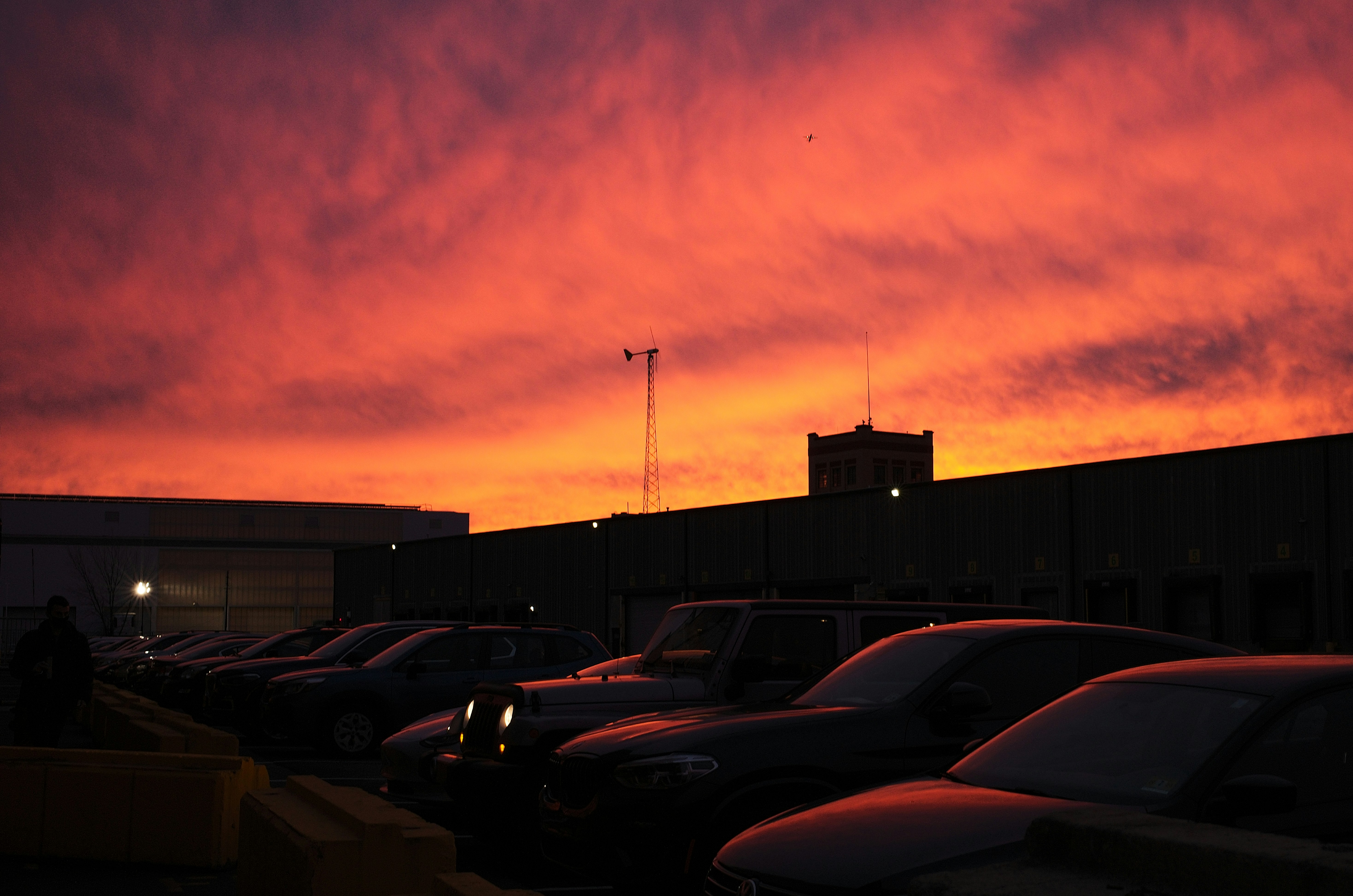 Crimson Dusk Over a Silent Car Lot