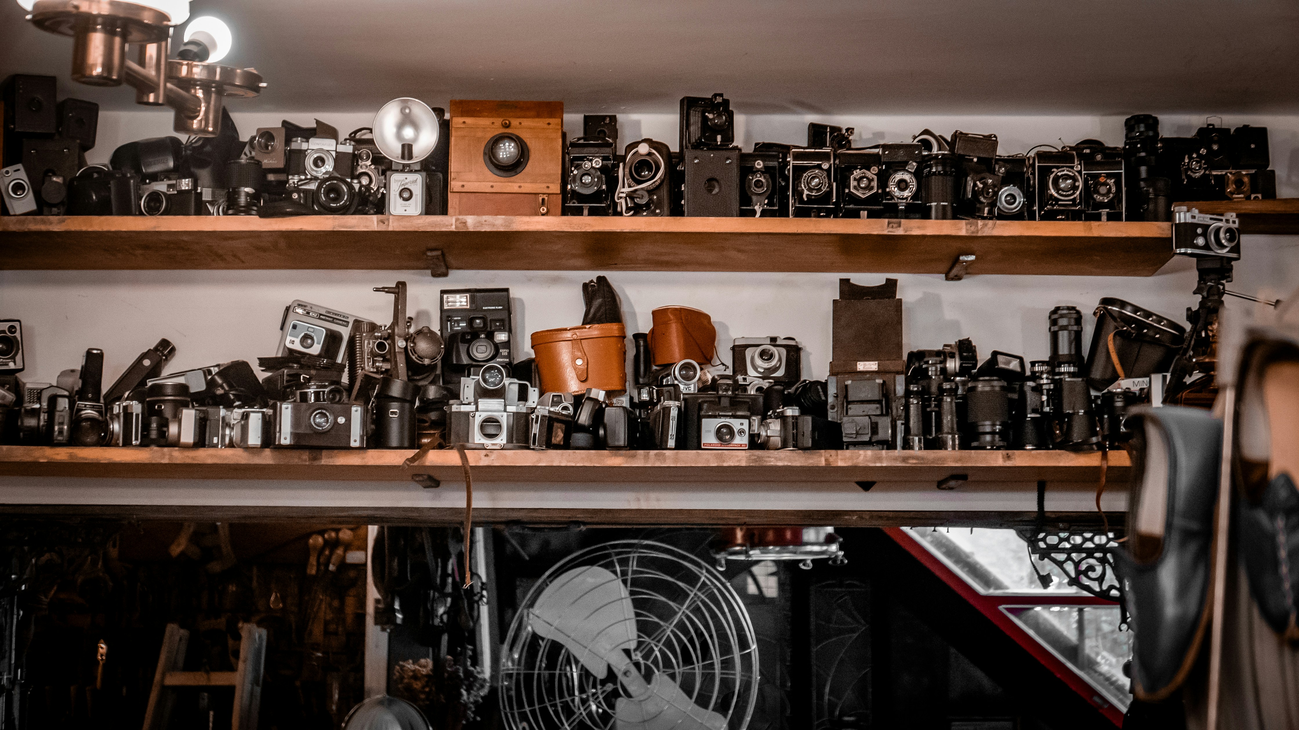 A room filled with lots of different types of cameras photo – Free ...