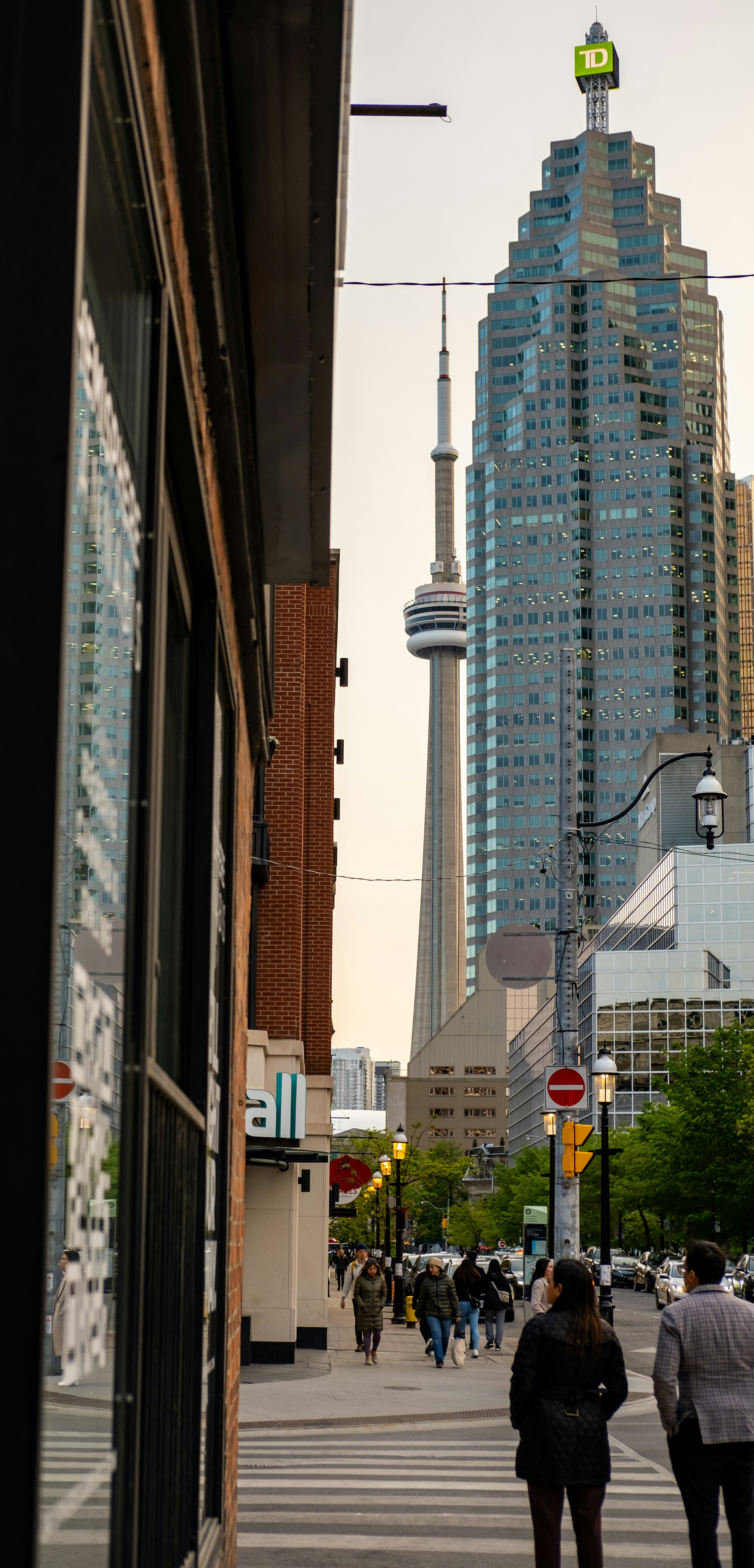 Narrow Street Frames Toronto's Skyline Toward the CN Tower