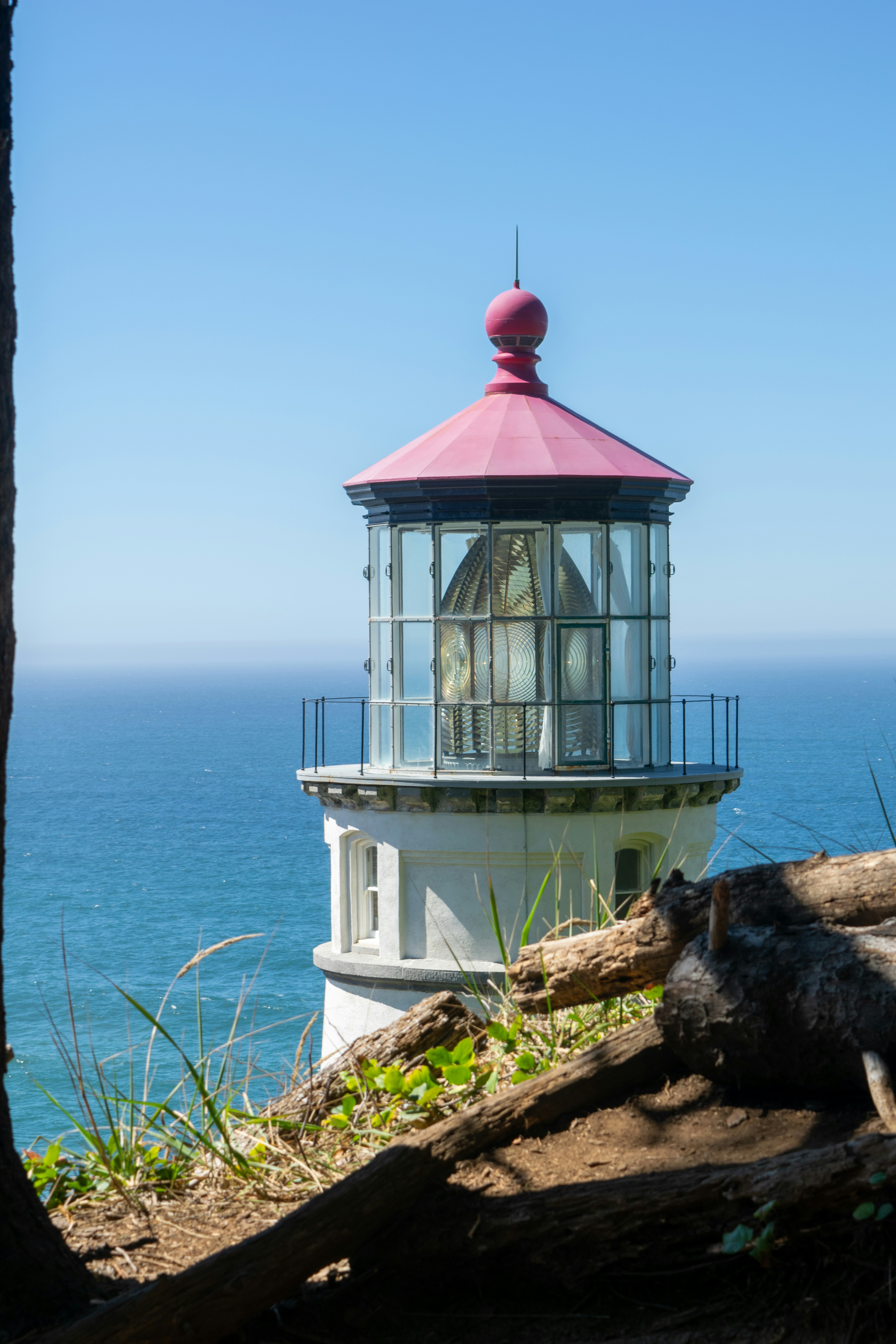 Azure Lantern on the Cliff: A Seaside Lighthouse Framing the Atlantic
