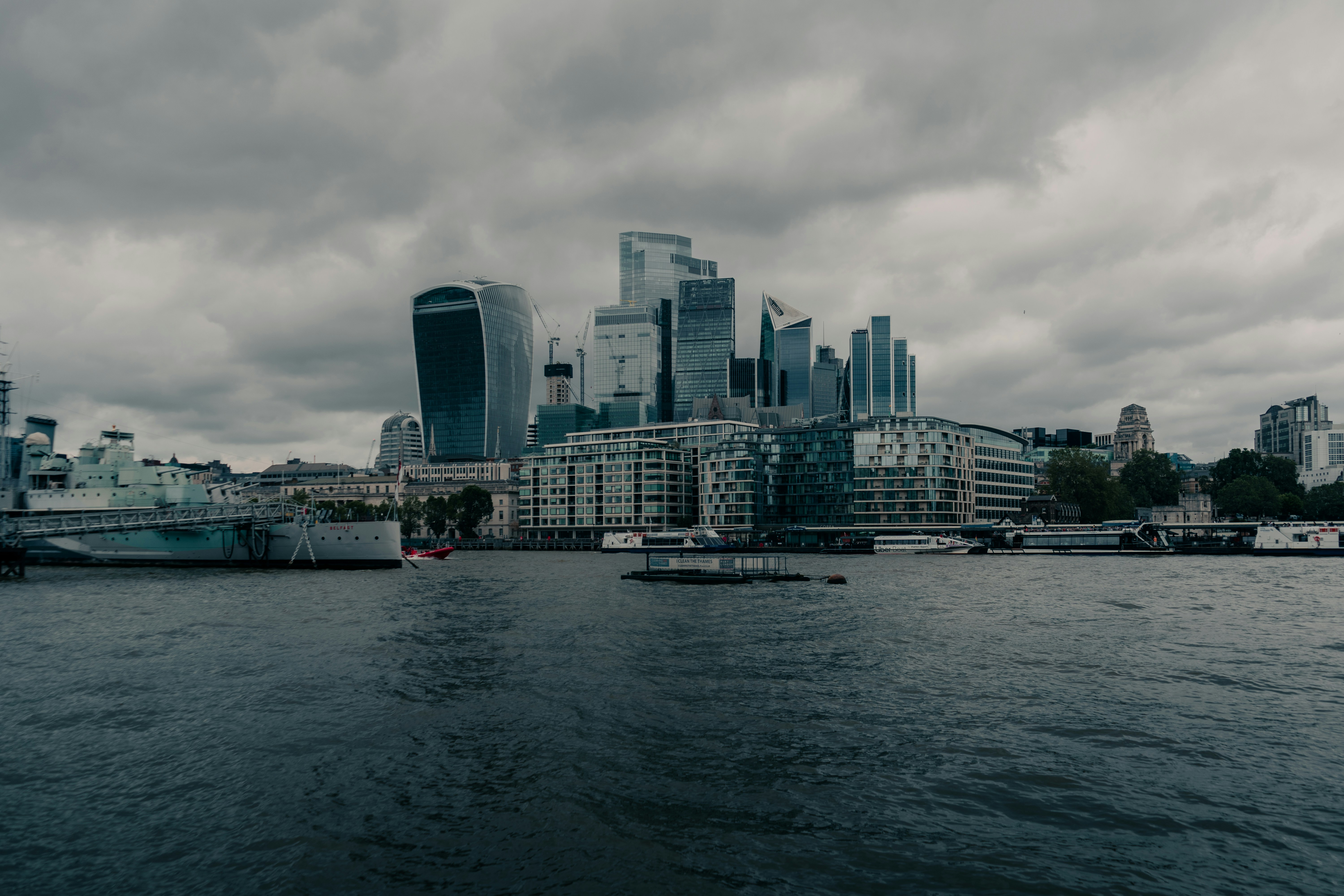 Urban Reflections: A Modern Skyline Amidst Gloomy Skies