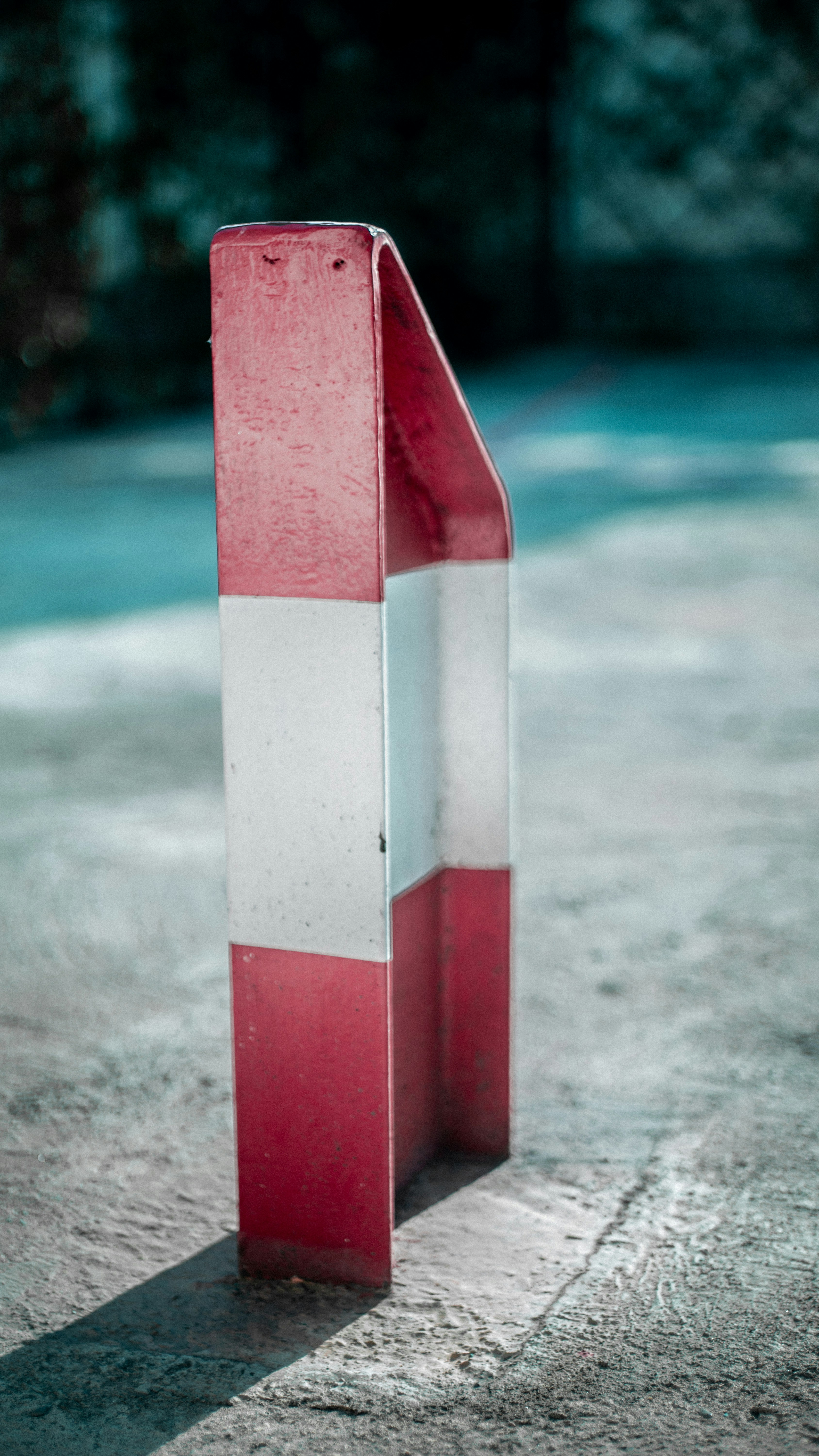 A close up of a red and white object on the ground photo – Free Fence ...