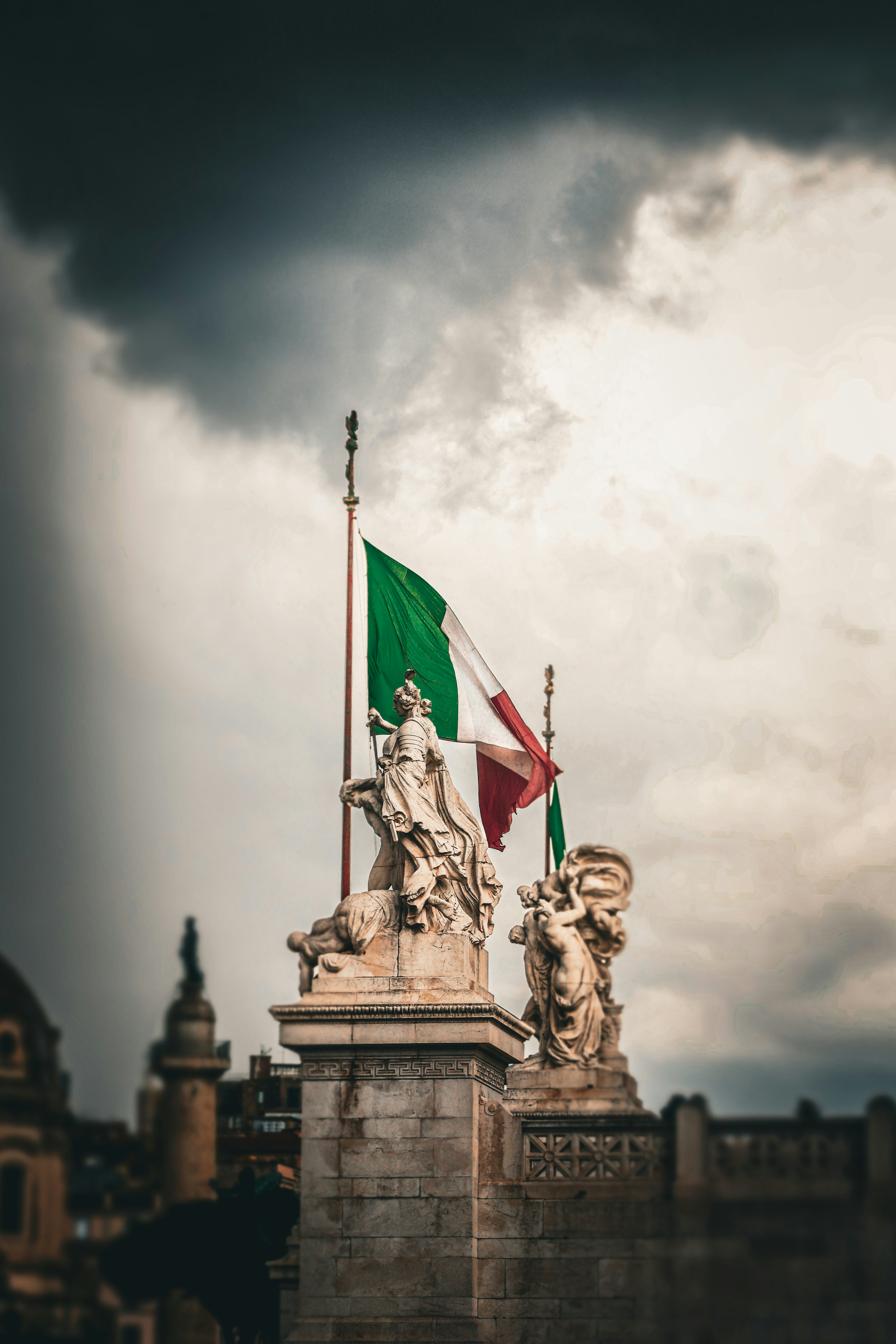 a statue with a flag on top of it