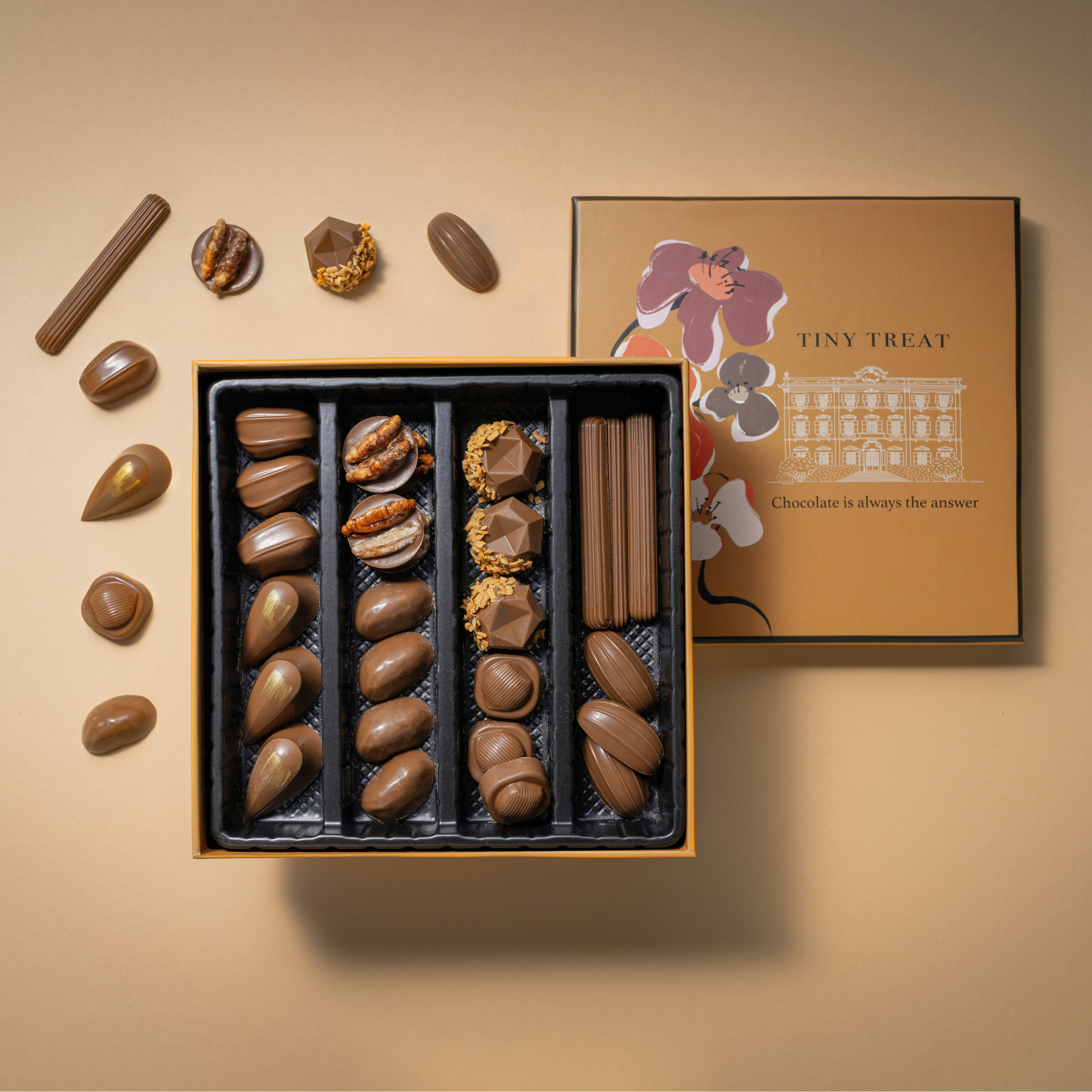 A box of assorted chocolates next to a book photo – Free Food Image on ...