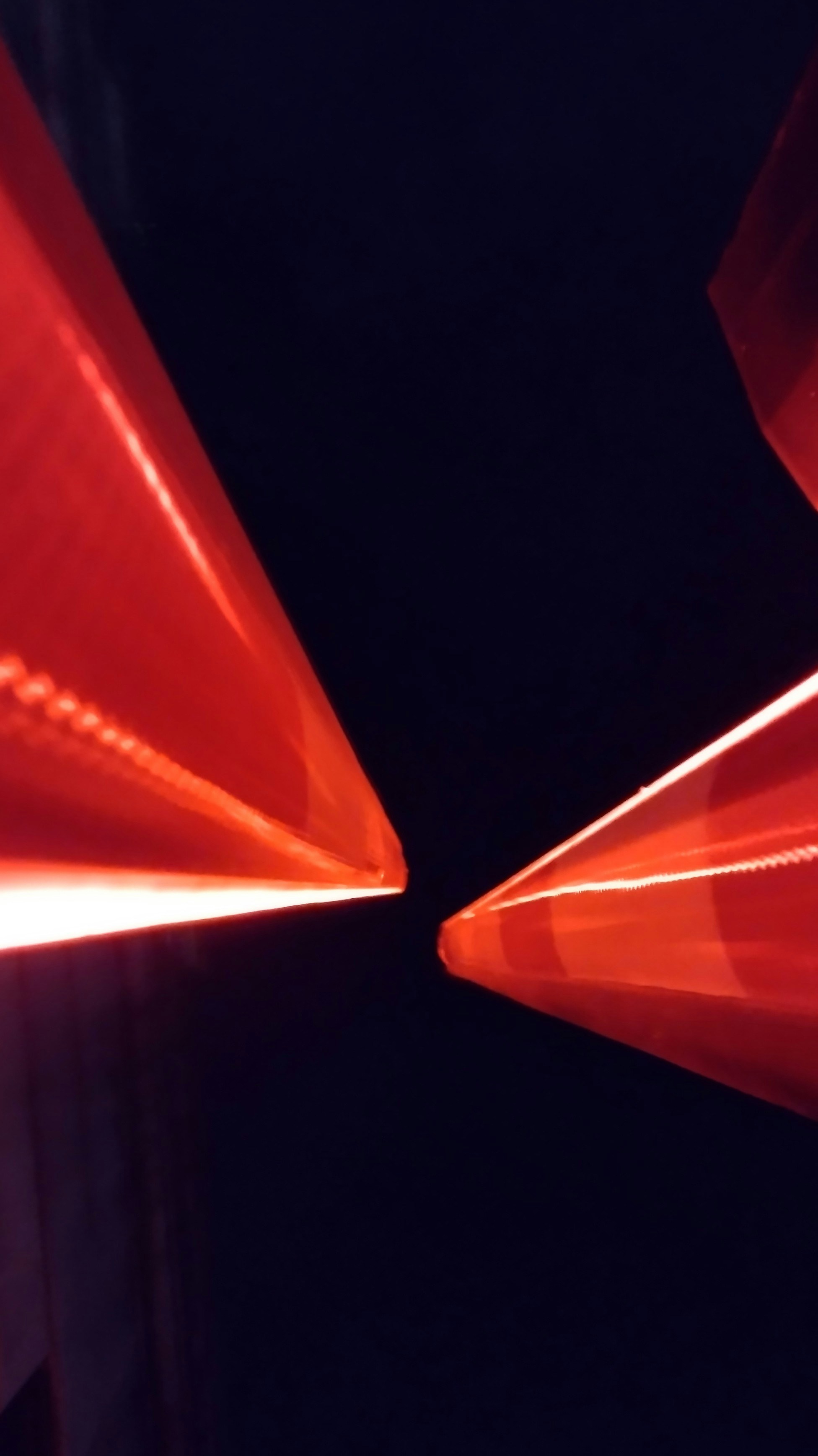 A close up of a red object on a black background photo – Free Abstract ...