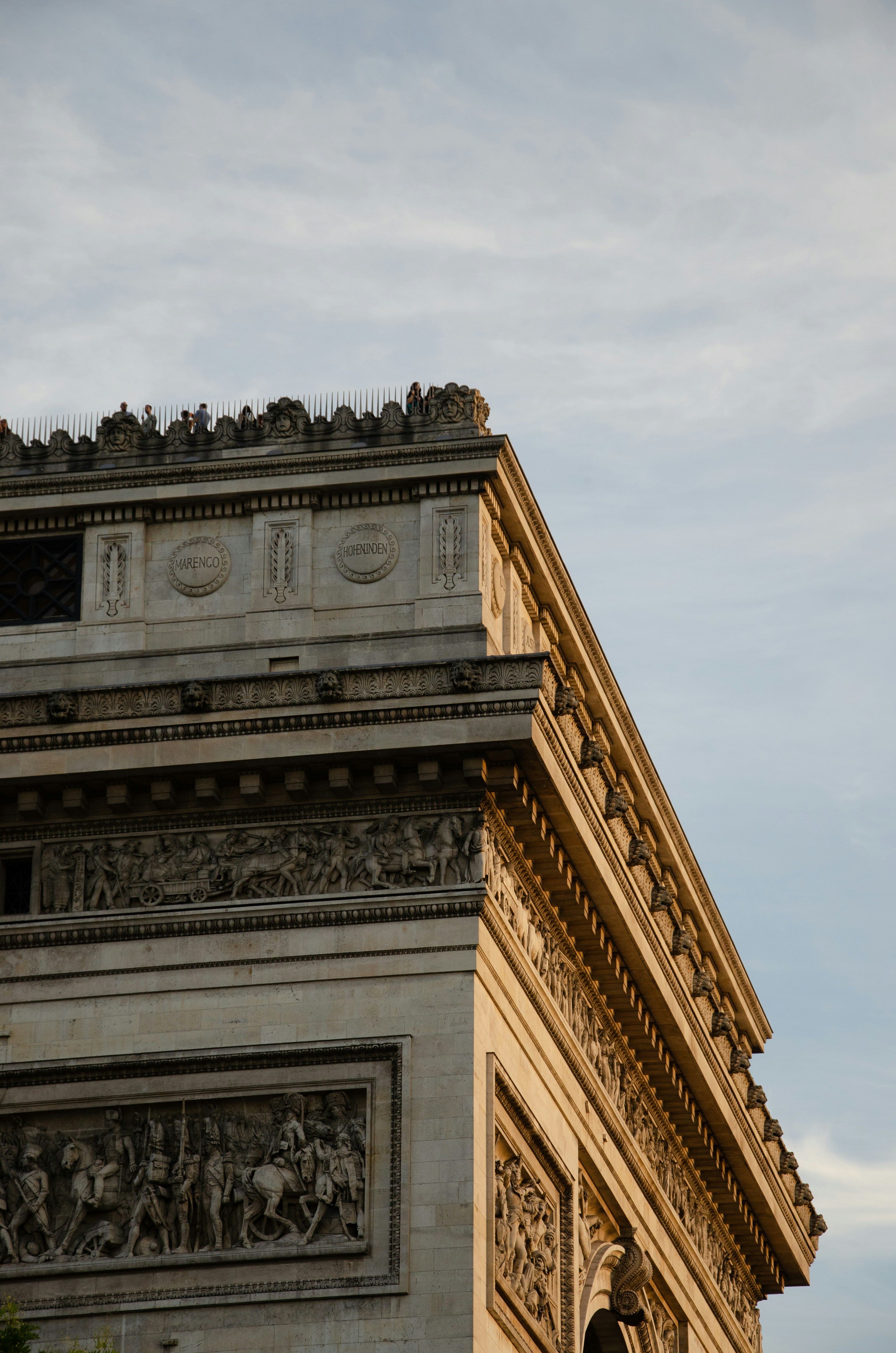 Angle from the Empire Arc: sunlit reliefs along a Parisian triumphal story