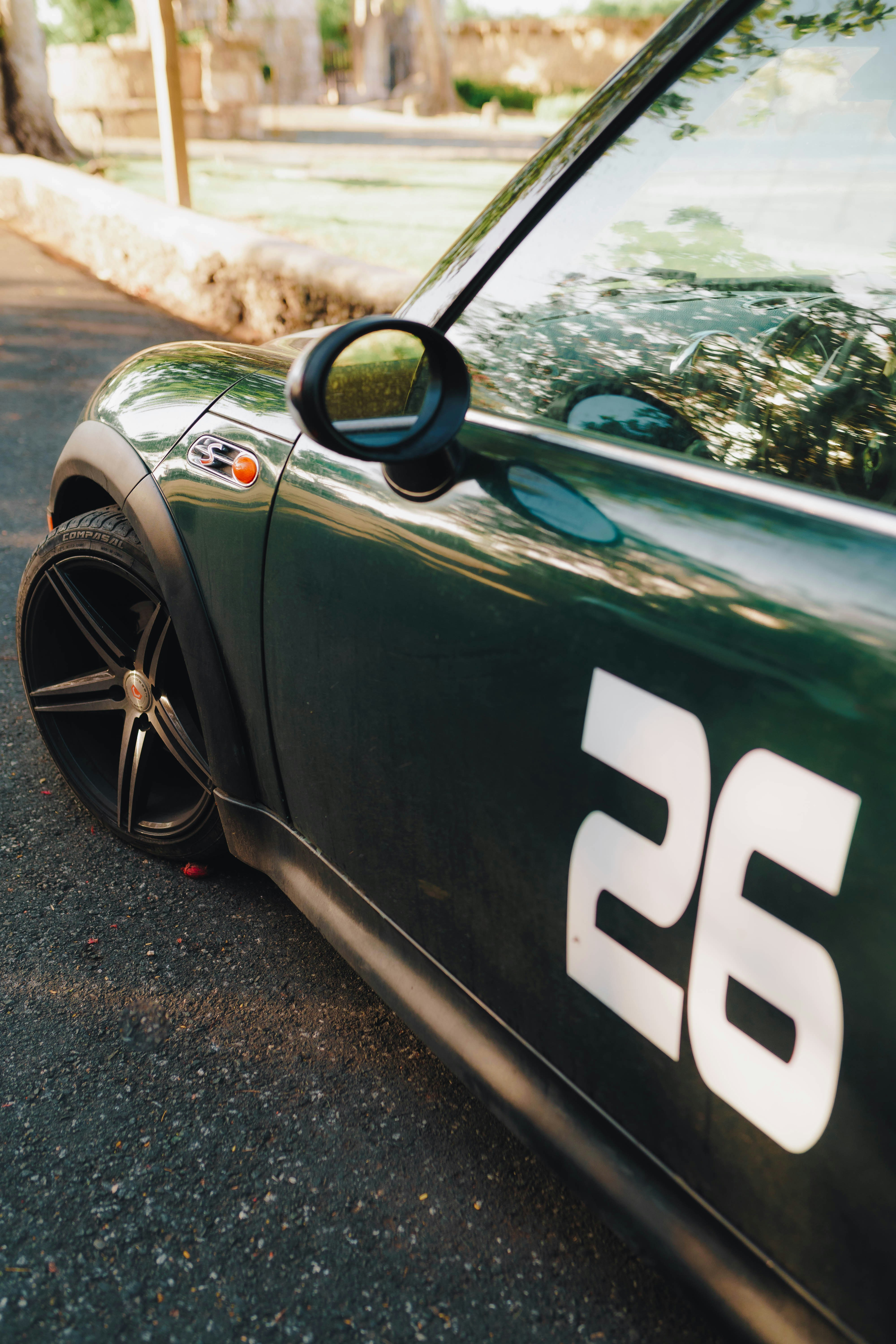 a close up of a car parked on the side of the road