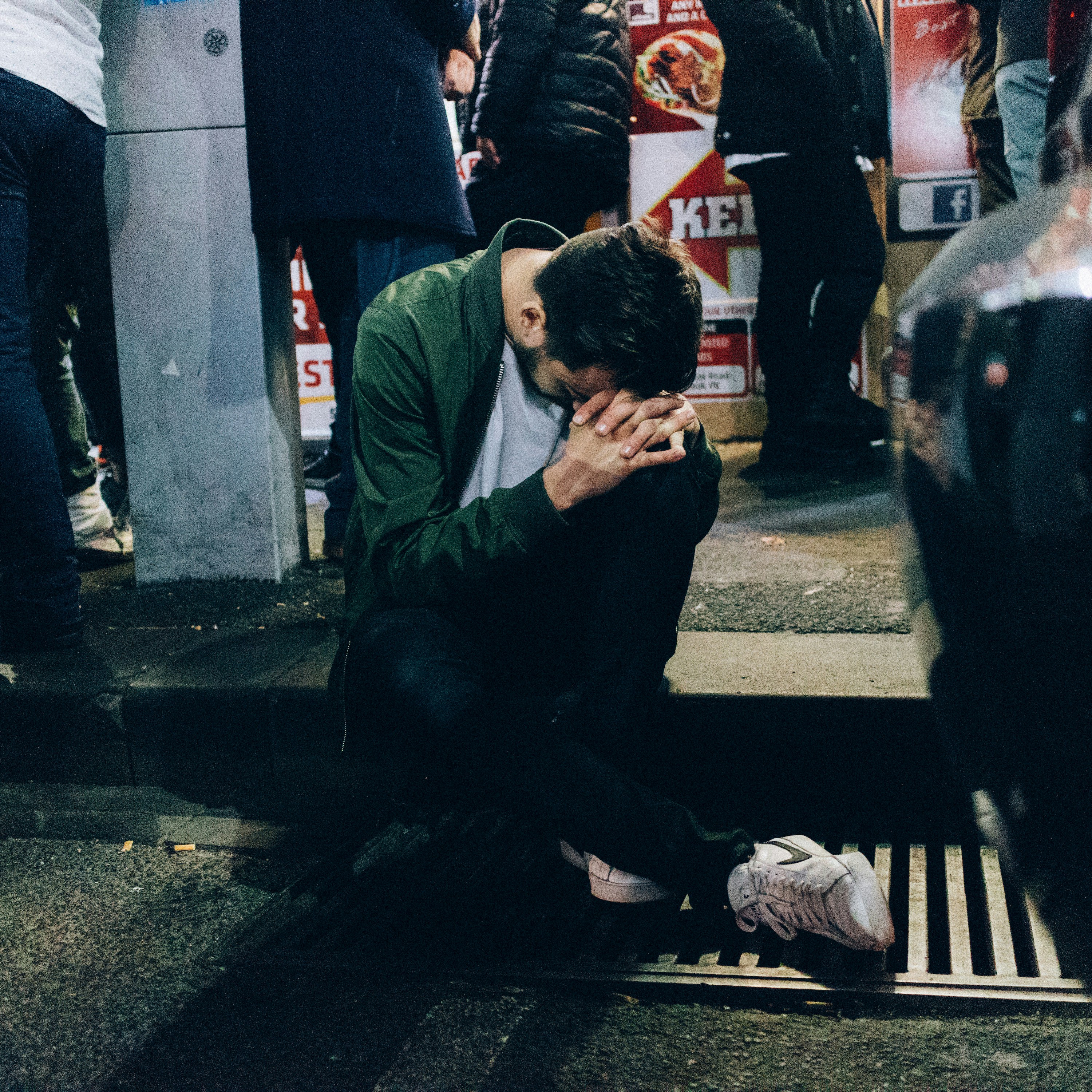 Neon Lullaby on a Curb: A Moment of Solitude in the City