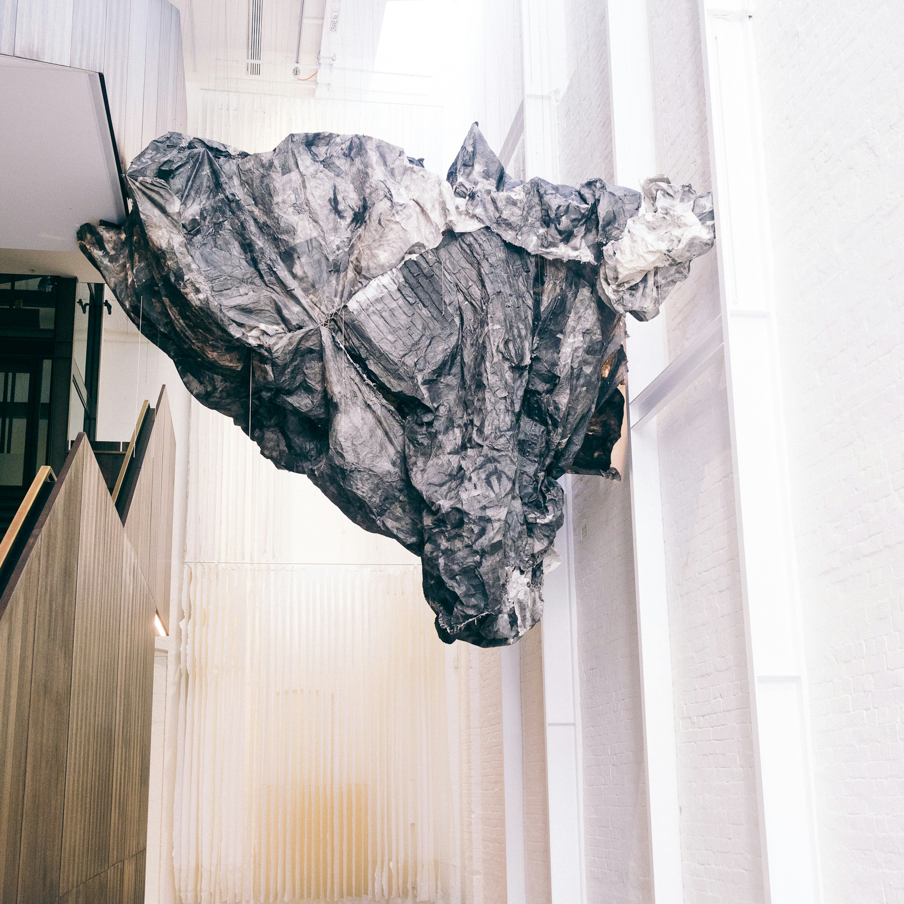 A large piece of paper hanging from a ceiling photo – Free White rabbit ...
