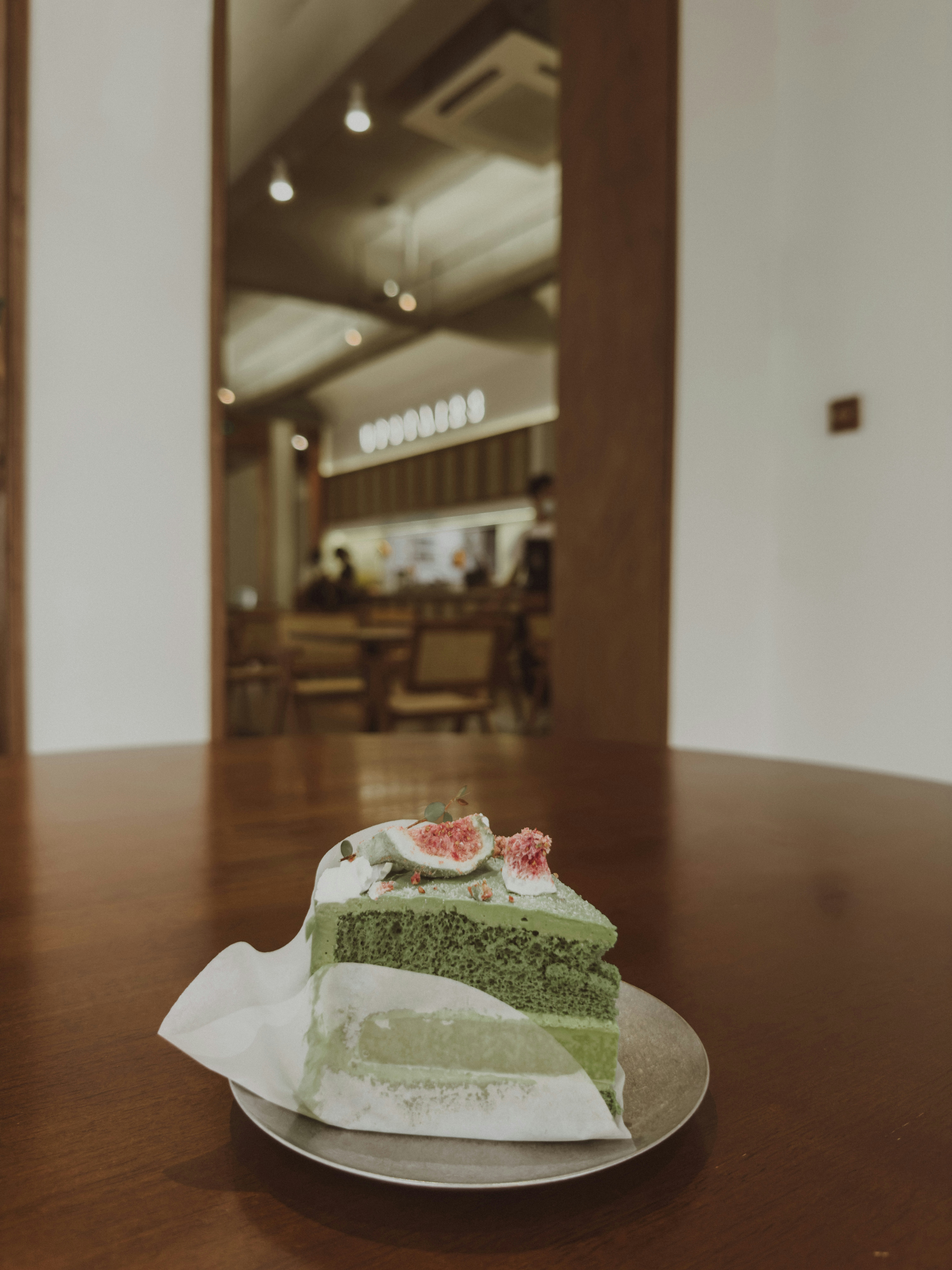 Verdant Slice: Green Tea Cake on a Quiet Café Evening