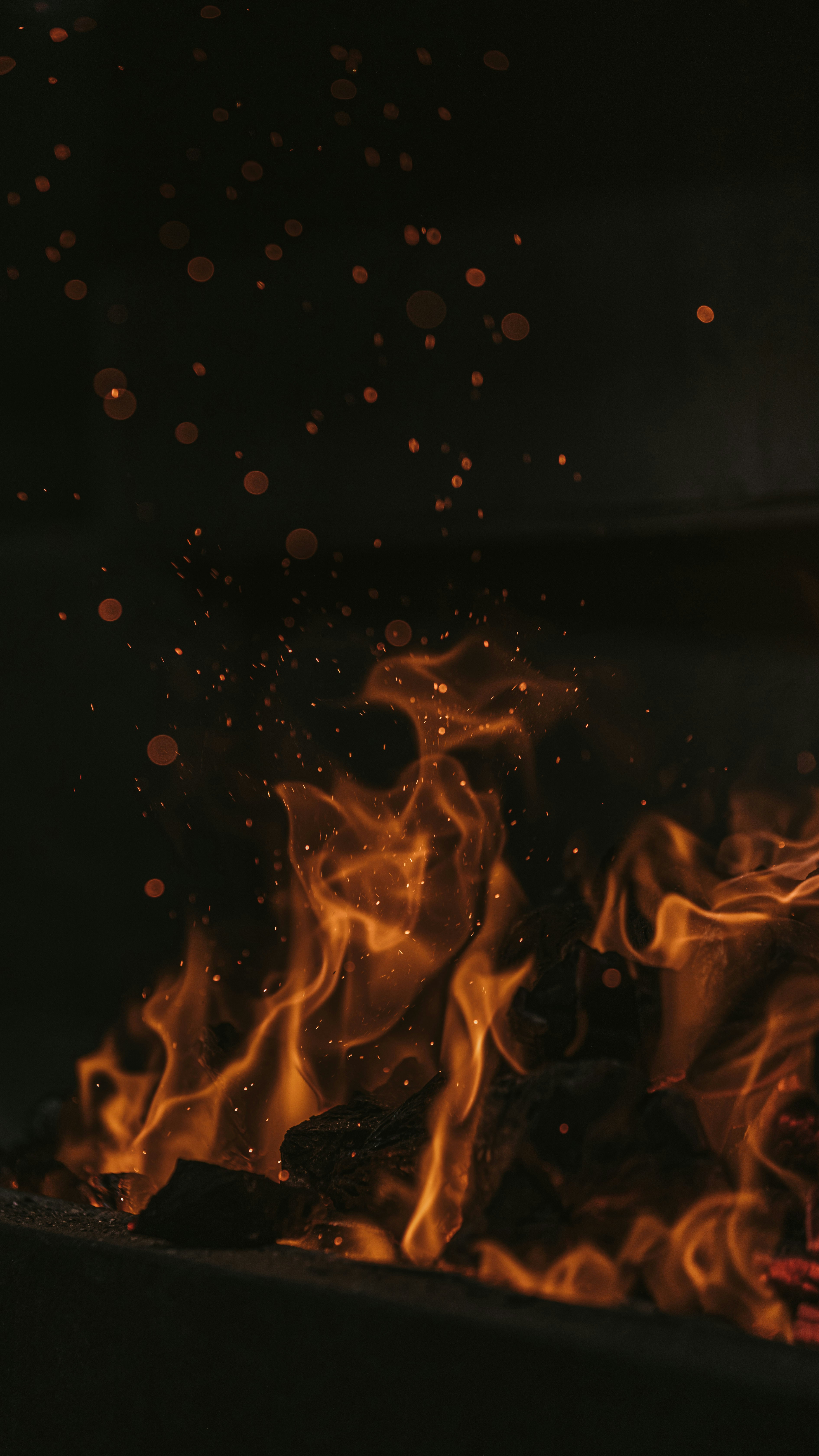 A close up of a fire burning in a fireplace photo – Free Fire Image on ...