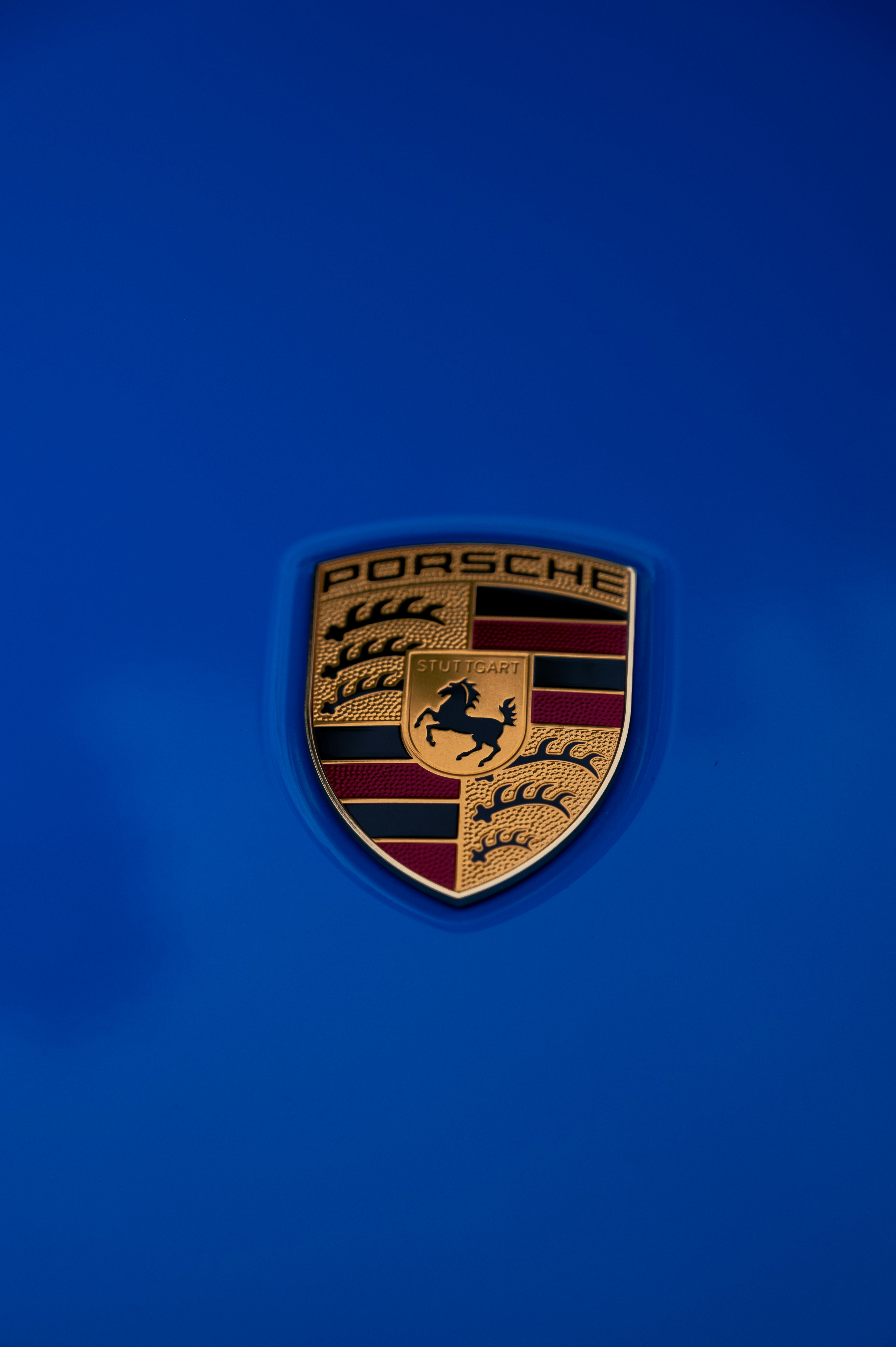 Azure Crest in Focus: Porsche Shield on a Blue Field