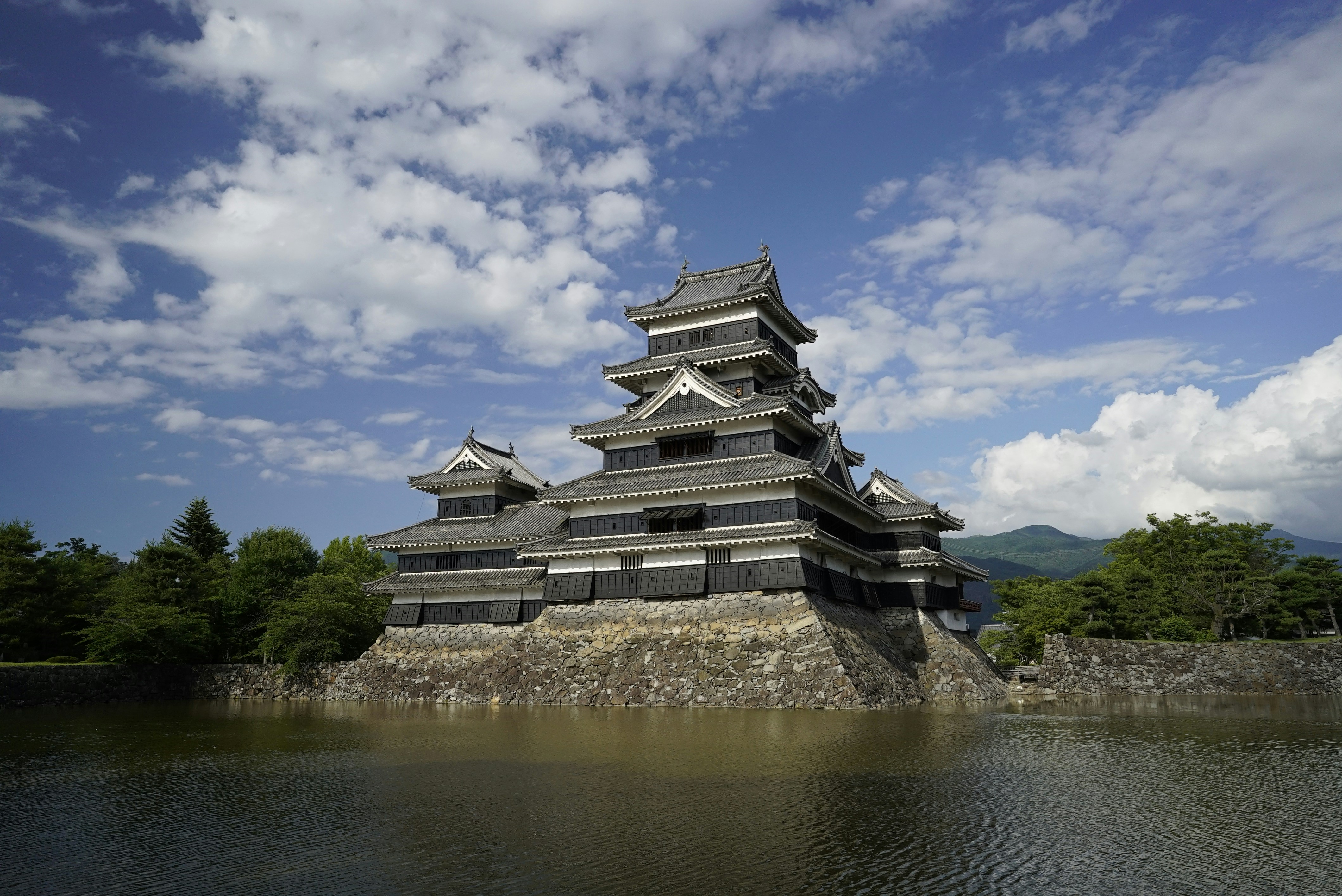 Castle Crowned by Sky Over a Tranquil Moat