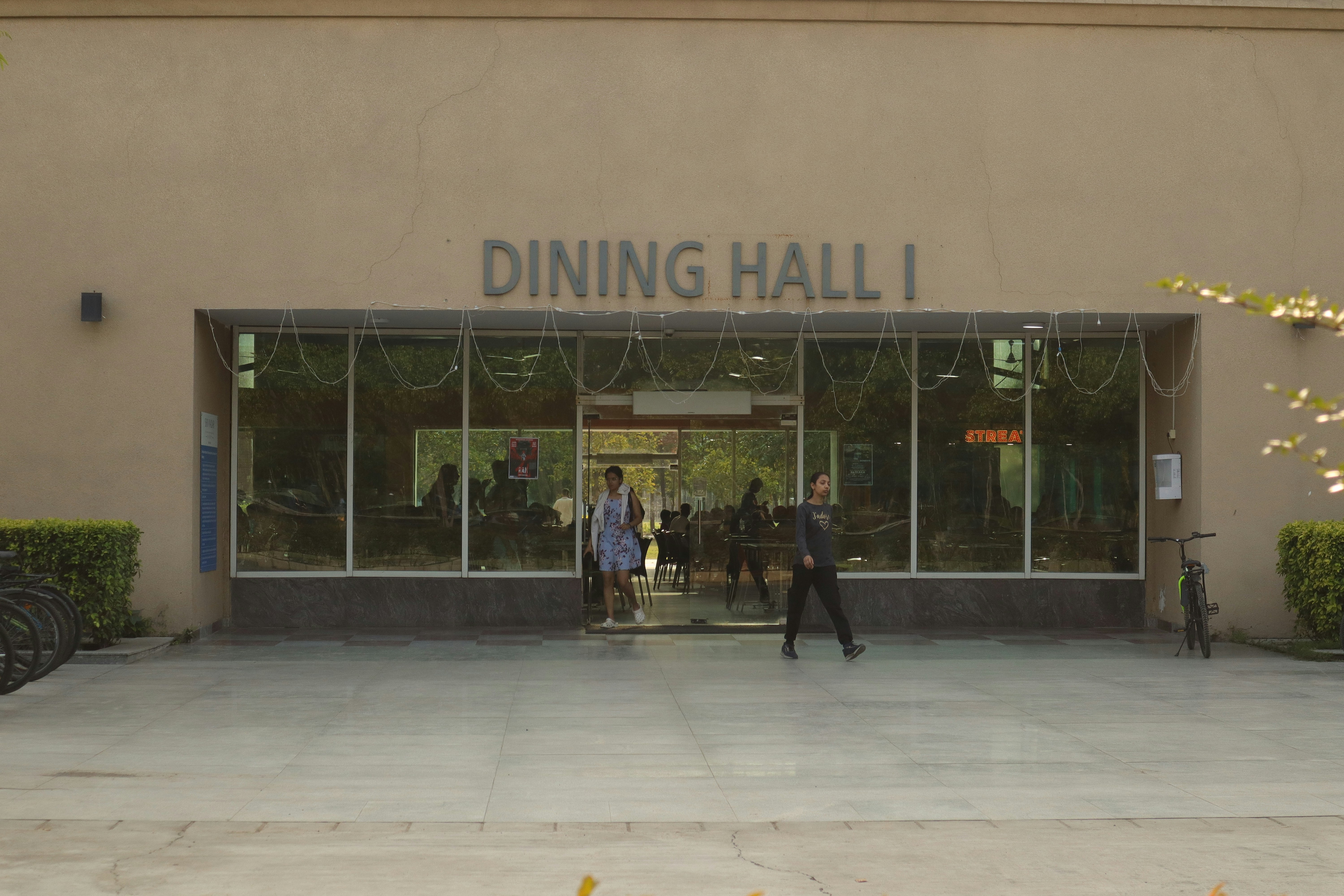A group of people walking out of a dining hall photo – Free College ...