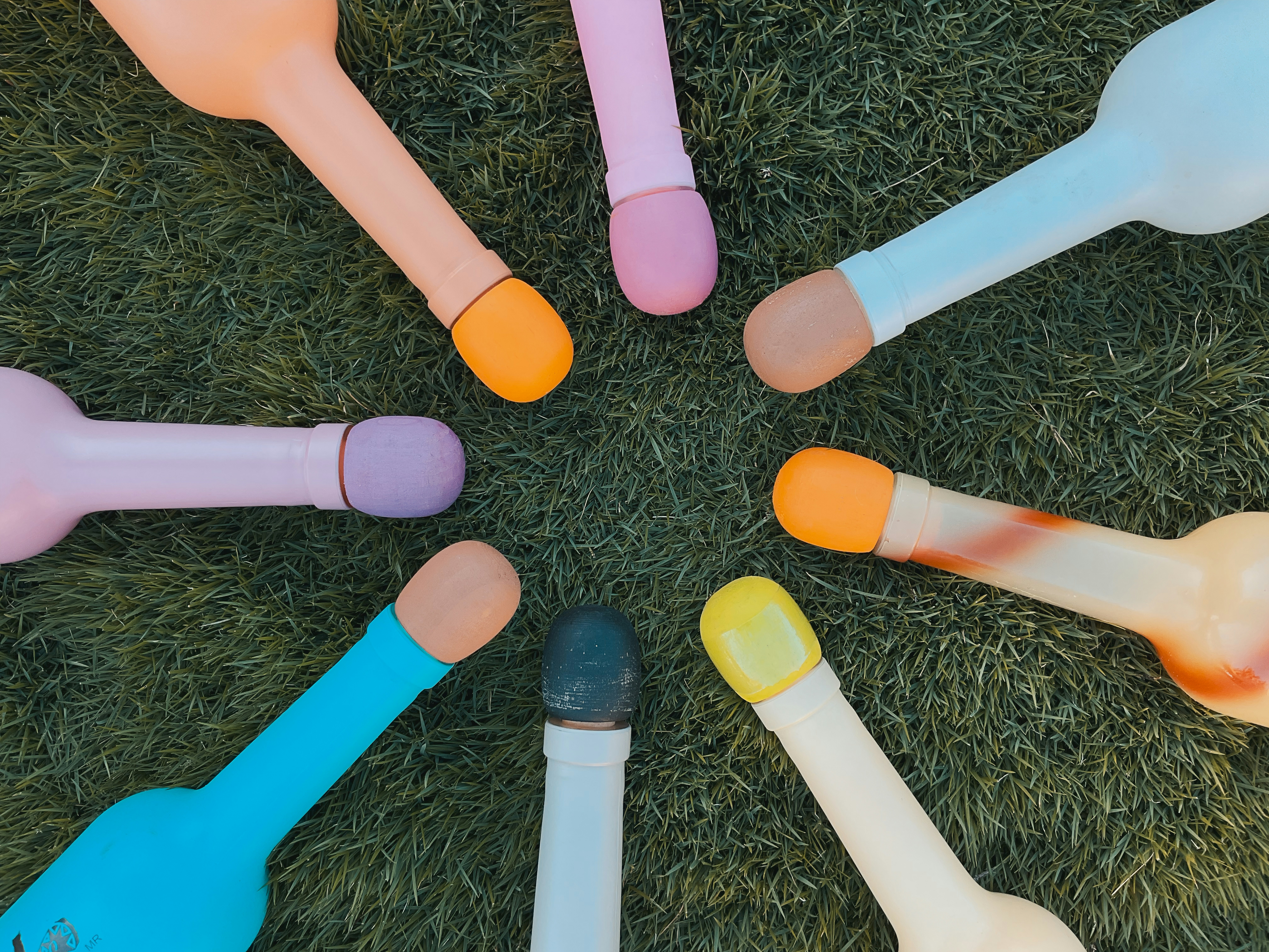 Circle of Colorful Silicone-Tip Styluses on Grass