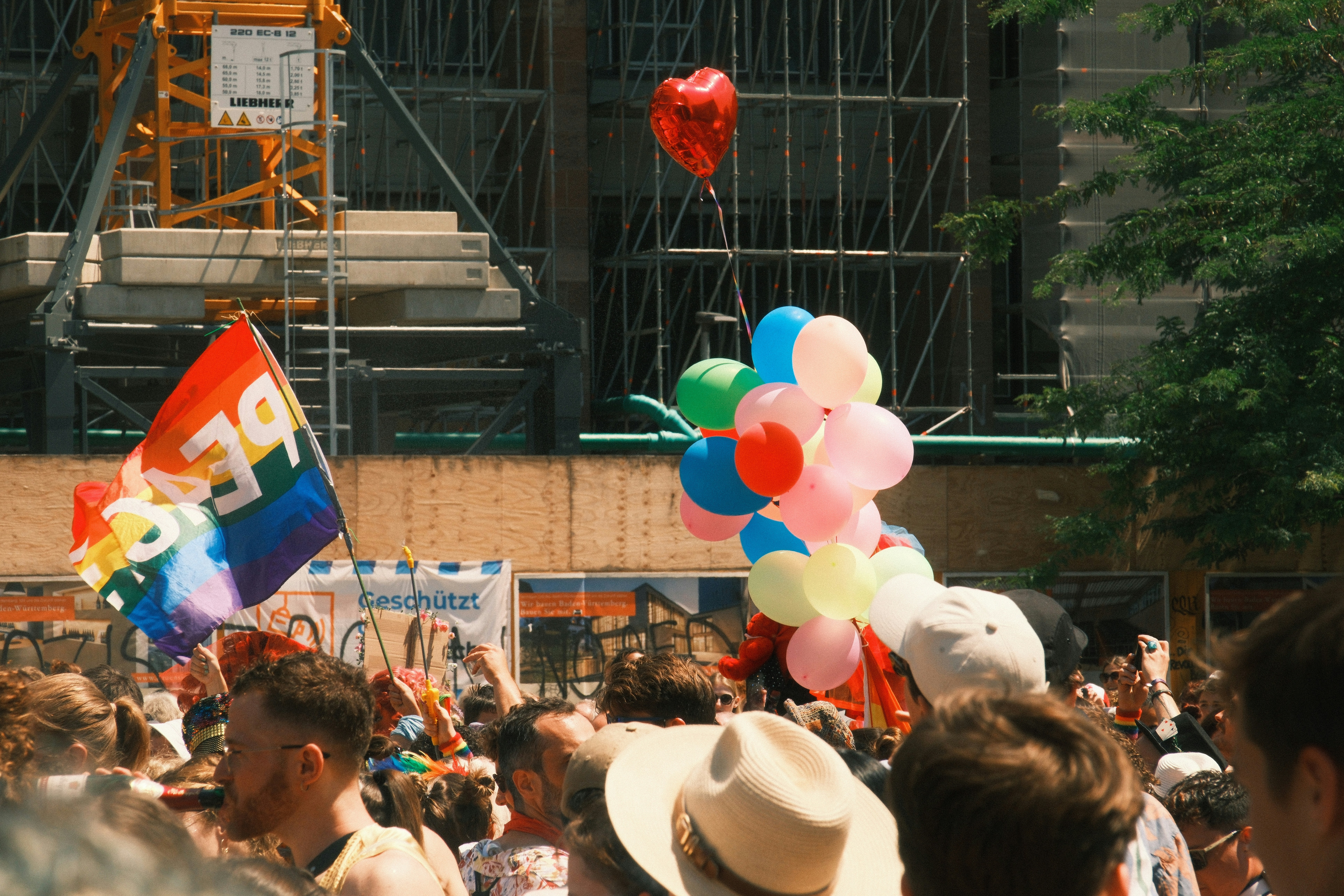 Balloon Bouquet Over a Lively City Parade