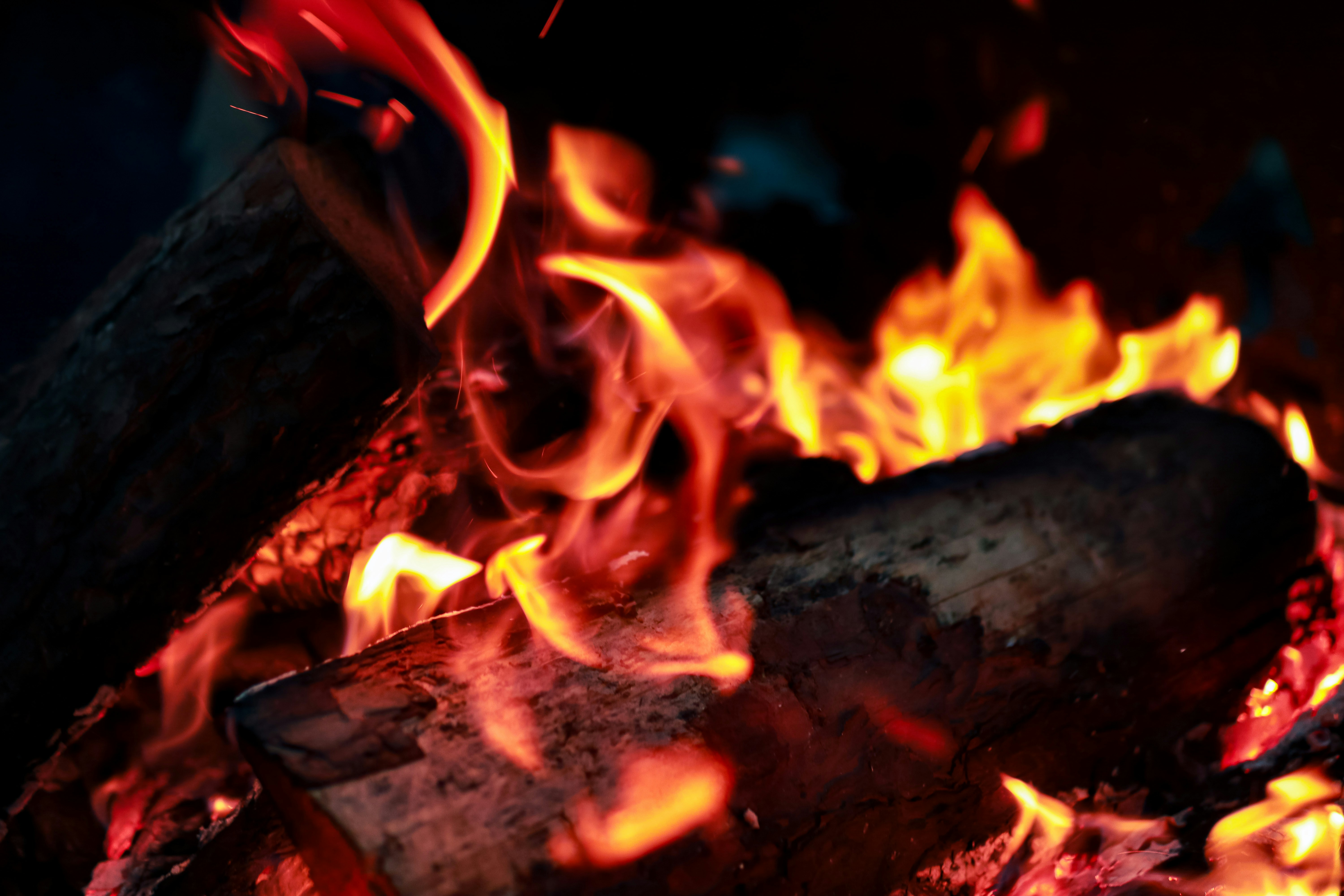 A close up of a fire burning in a fireplace photo – Free Fire Image on ...