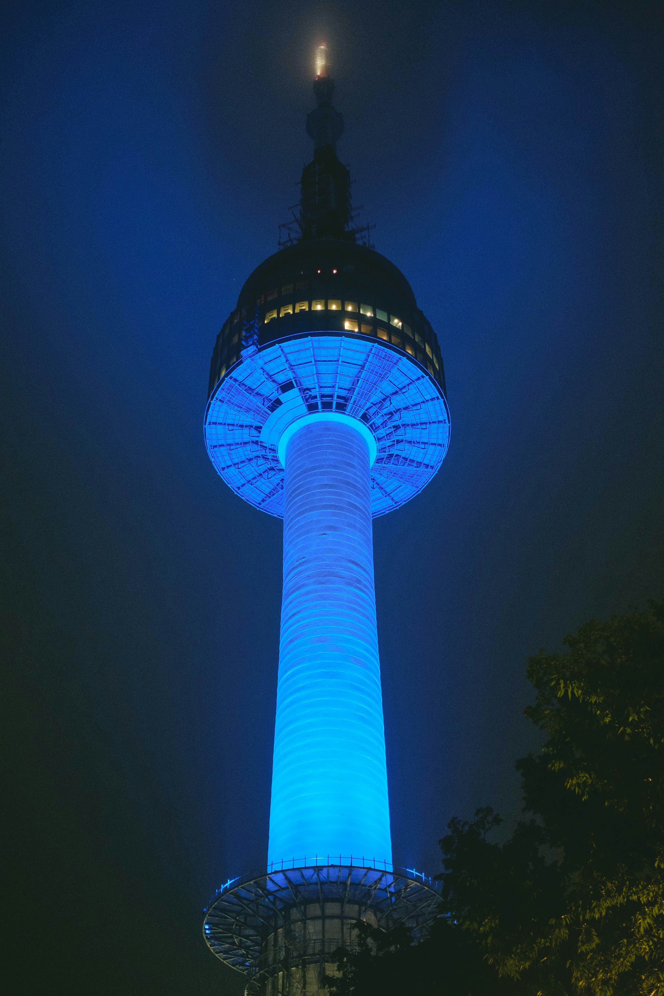 Azure Spire: Berlin's Blue-Illuminated TV Tower at Night