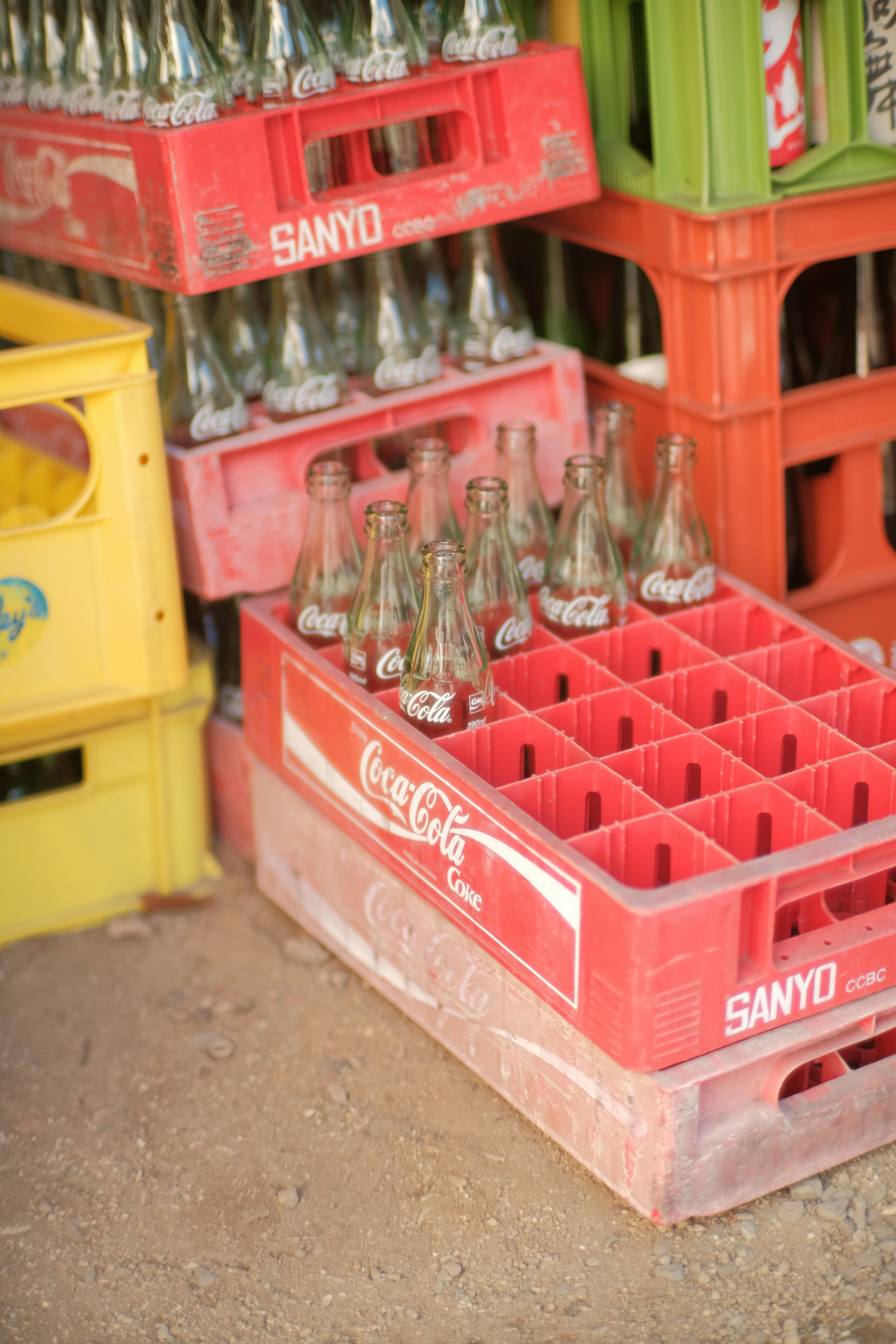 Crimson Crates, Clear Bottles: A Market Scene in Coca-Cola Red