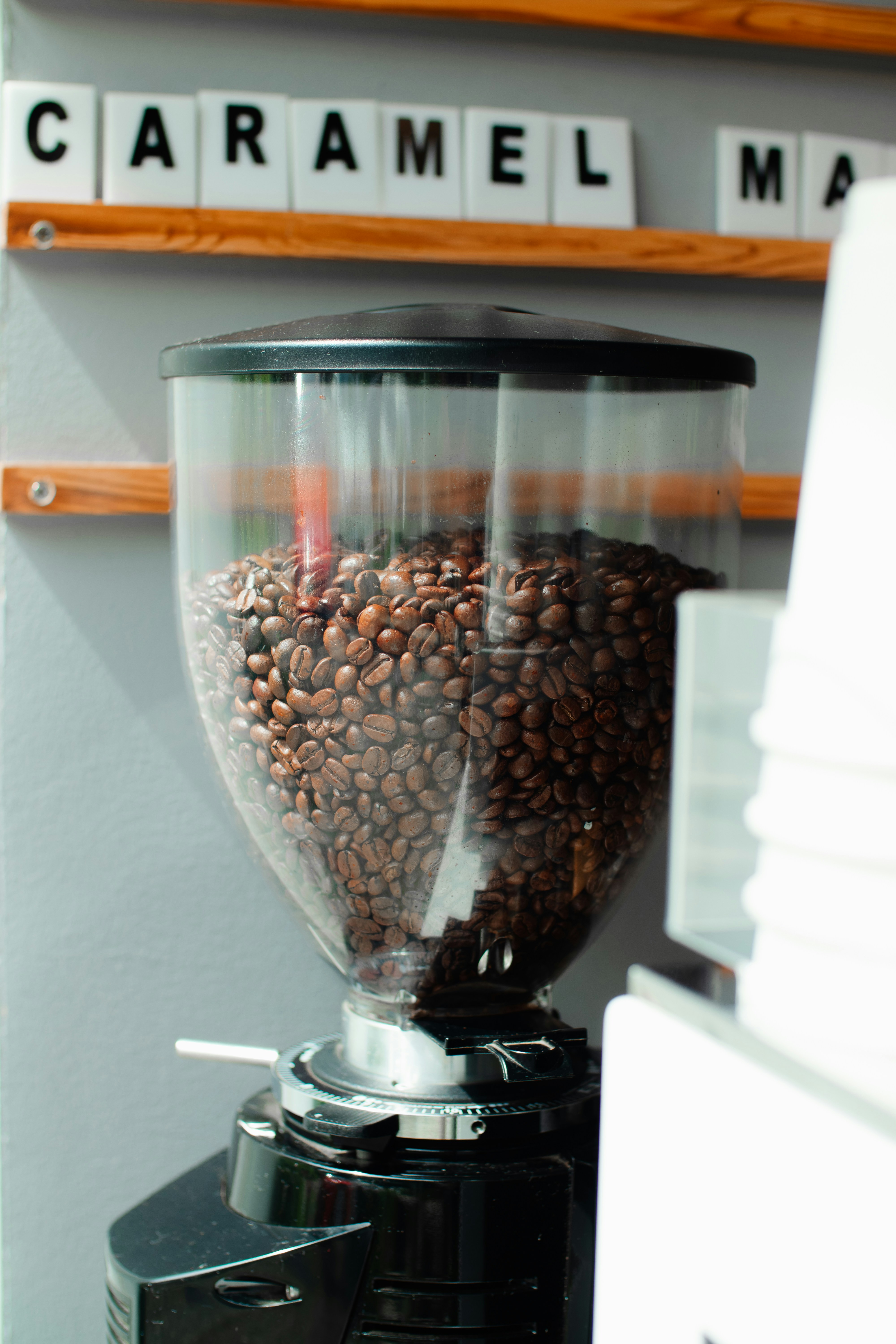 Caramel Sign, Glass Grinder: A Close-Up of Roasted Beans