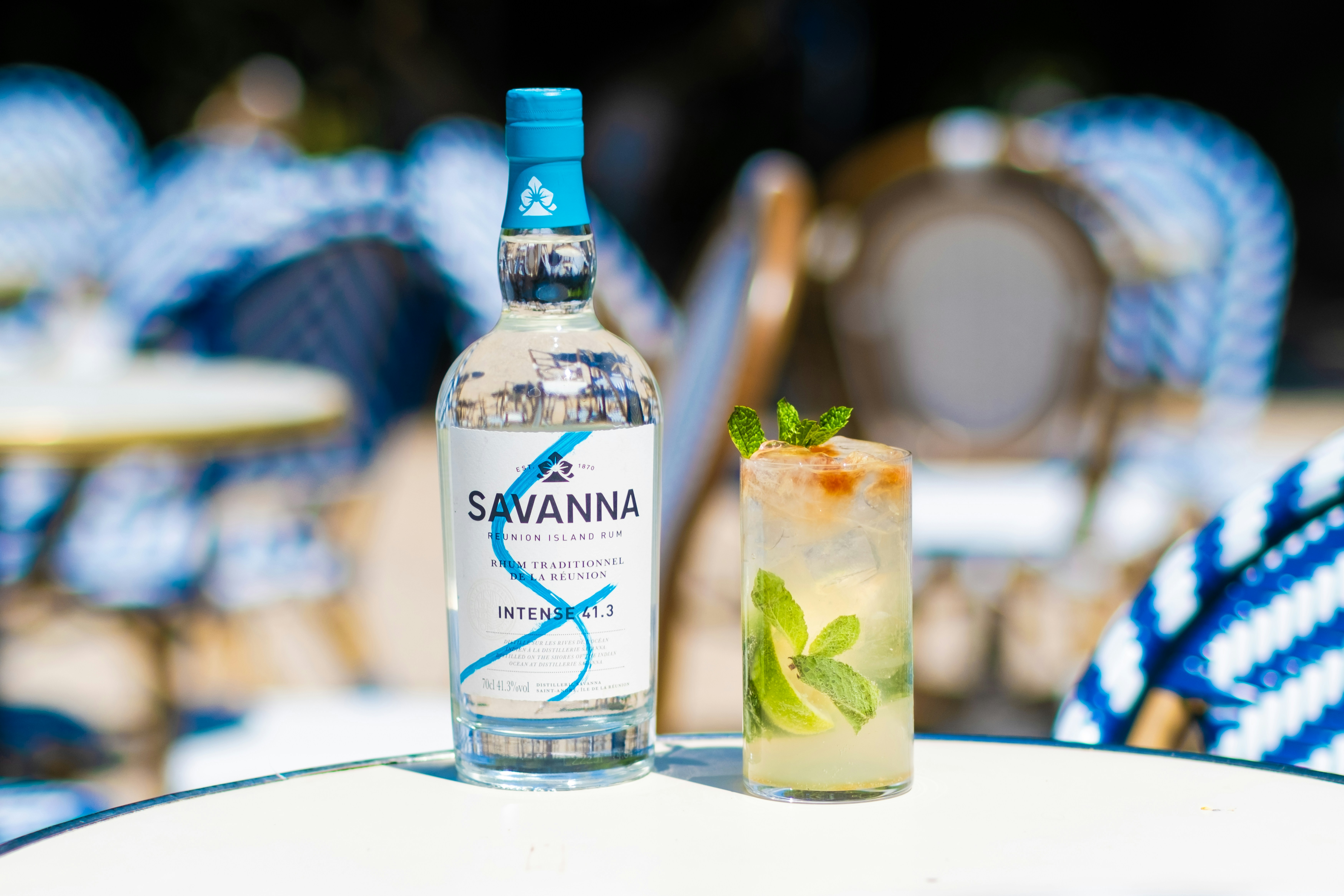 A Lime Mint Refresher Beside a Bottled Spirit