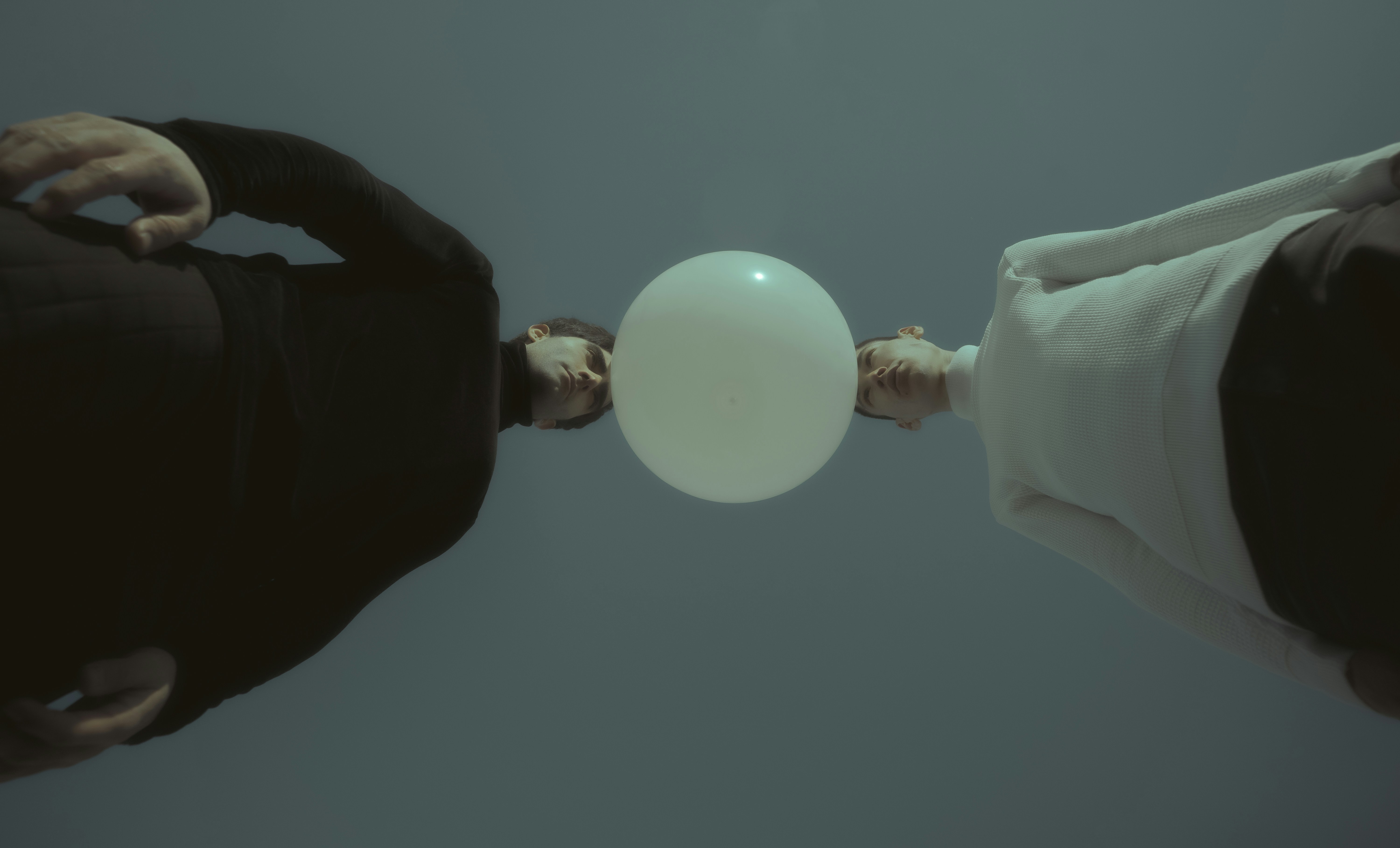 Centered Balloon, Twin Gaze: A Minimal Symmetrical Portrait