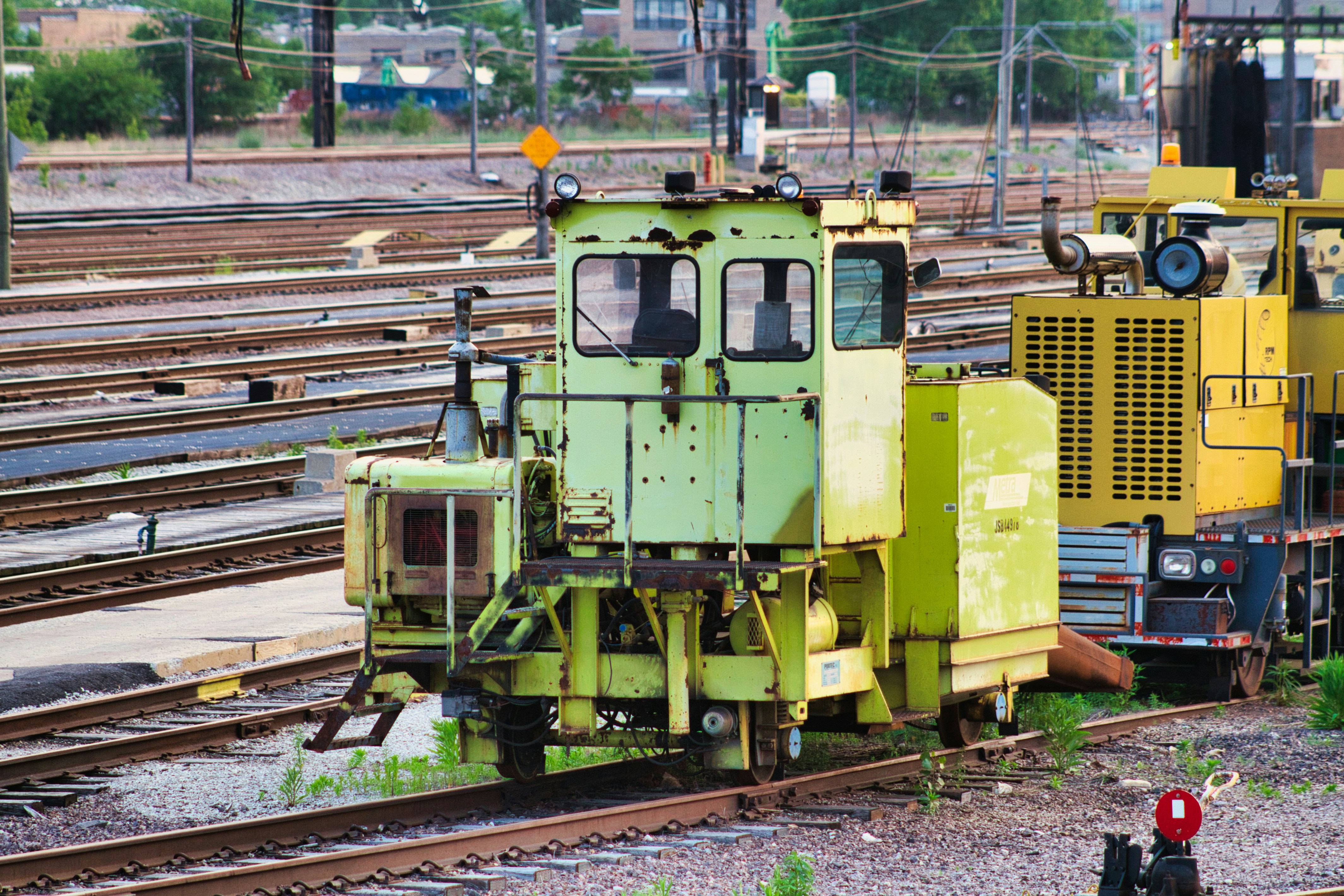 Weathered Green Switcher Anchors a Quiet Rail Yard
