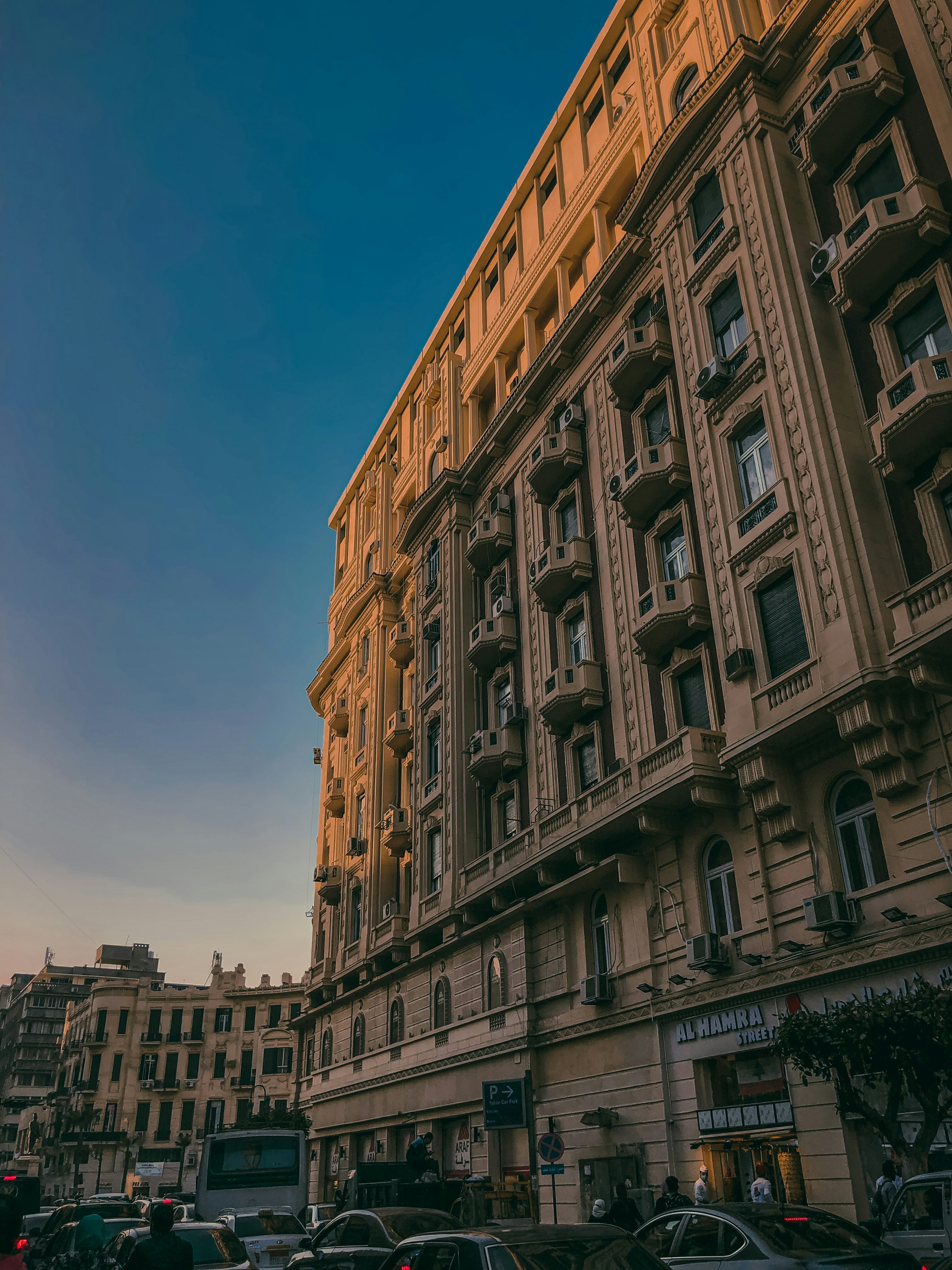 A very tall building with many windows and balconies photo – Free Cairo ...