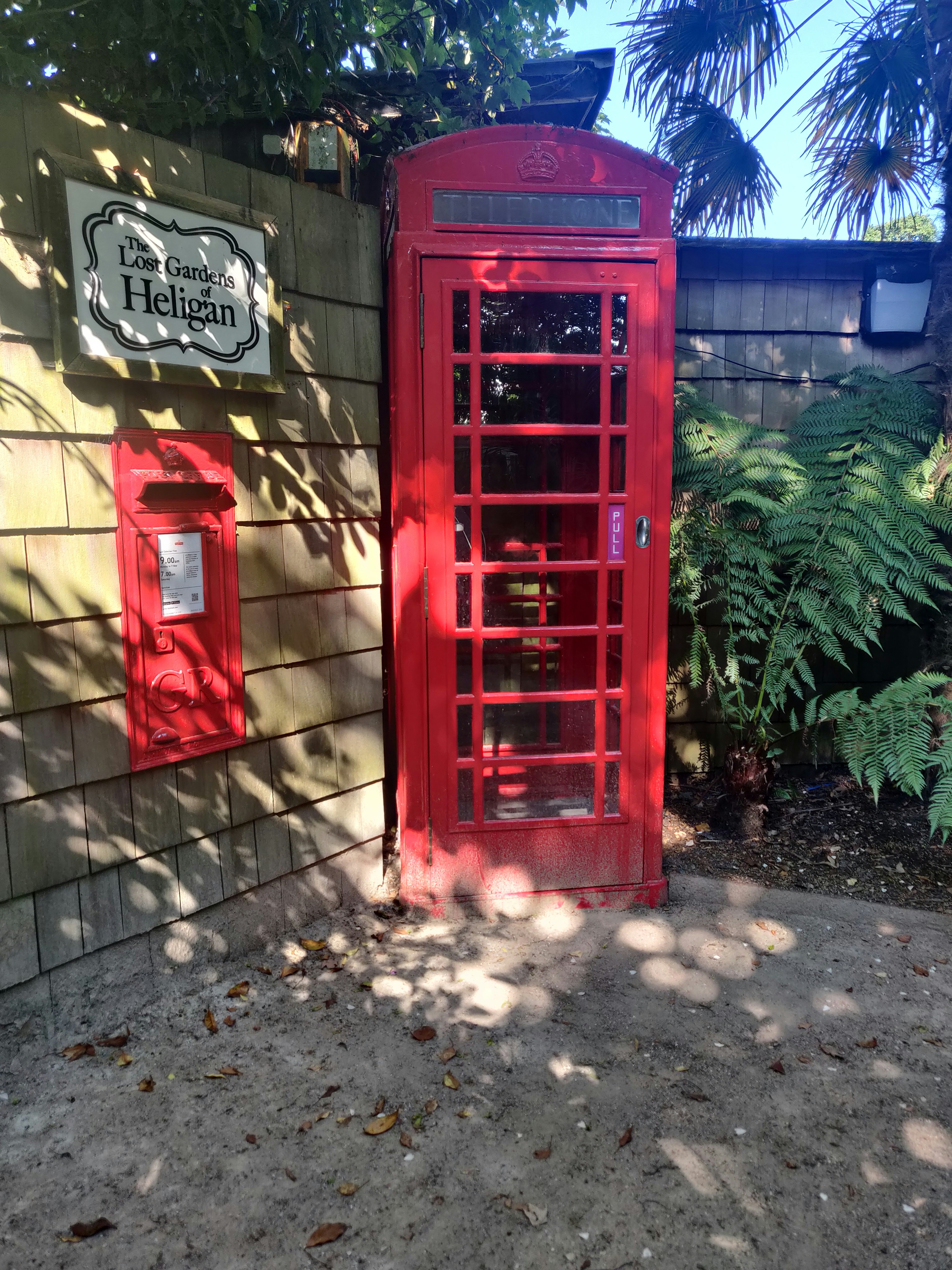 Crimson Kiosk Framed by Ferns at Heligan