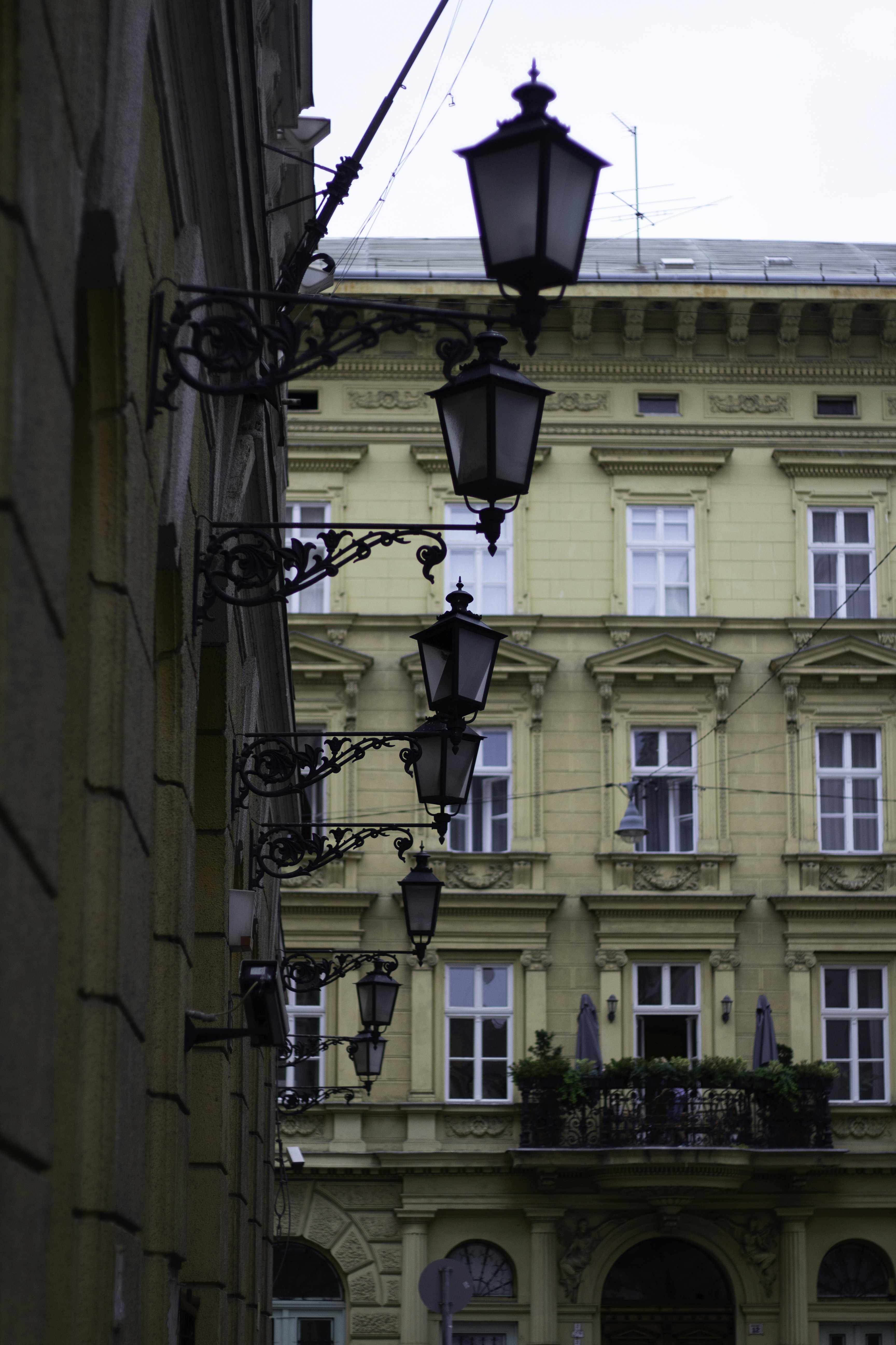 Lantern Chorus Along a Neoclassical Facade