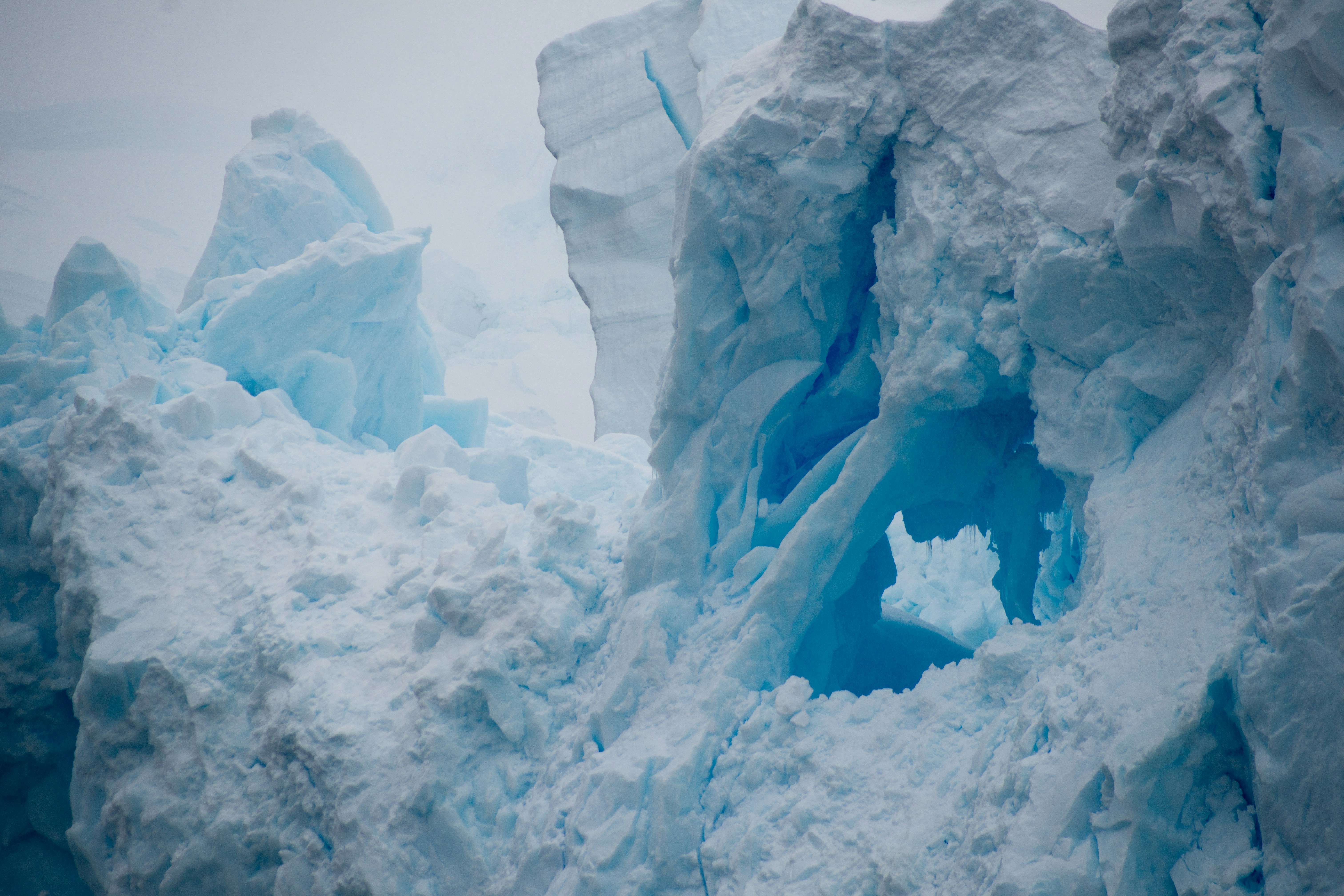 A very large ice cave with lots of snow photo – Free Glacier Image on ...