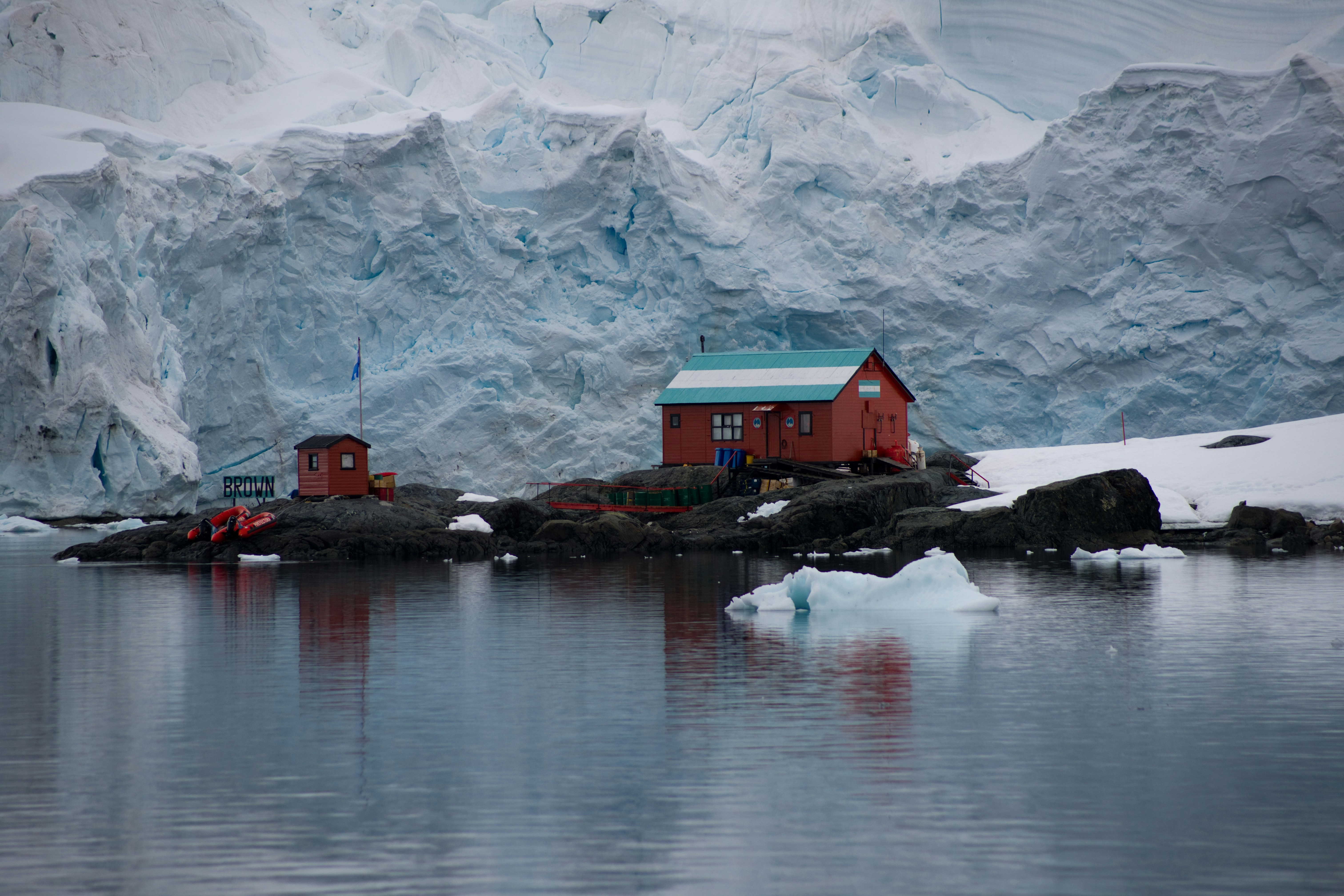 Crimson Cabins at the Icebound Shore