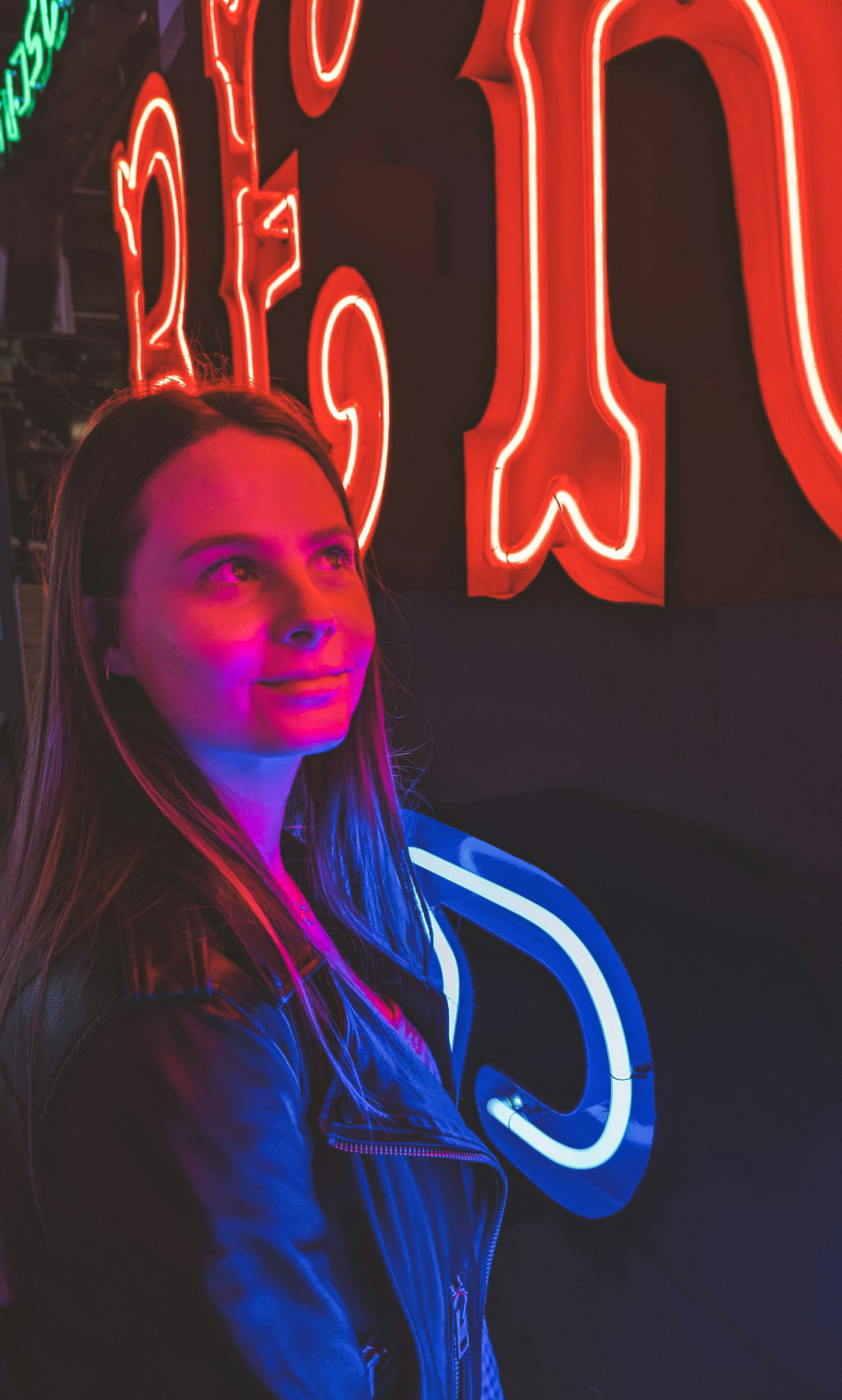 Neon Portrait Under Crimson and Azure Glow