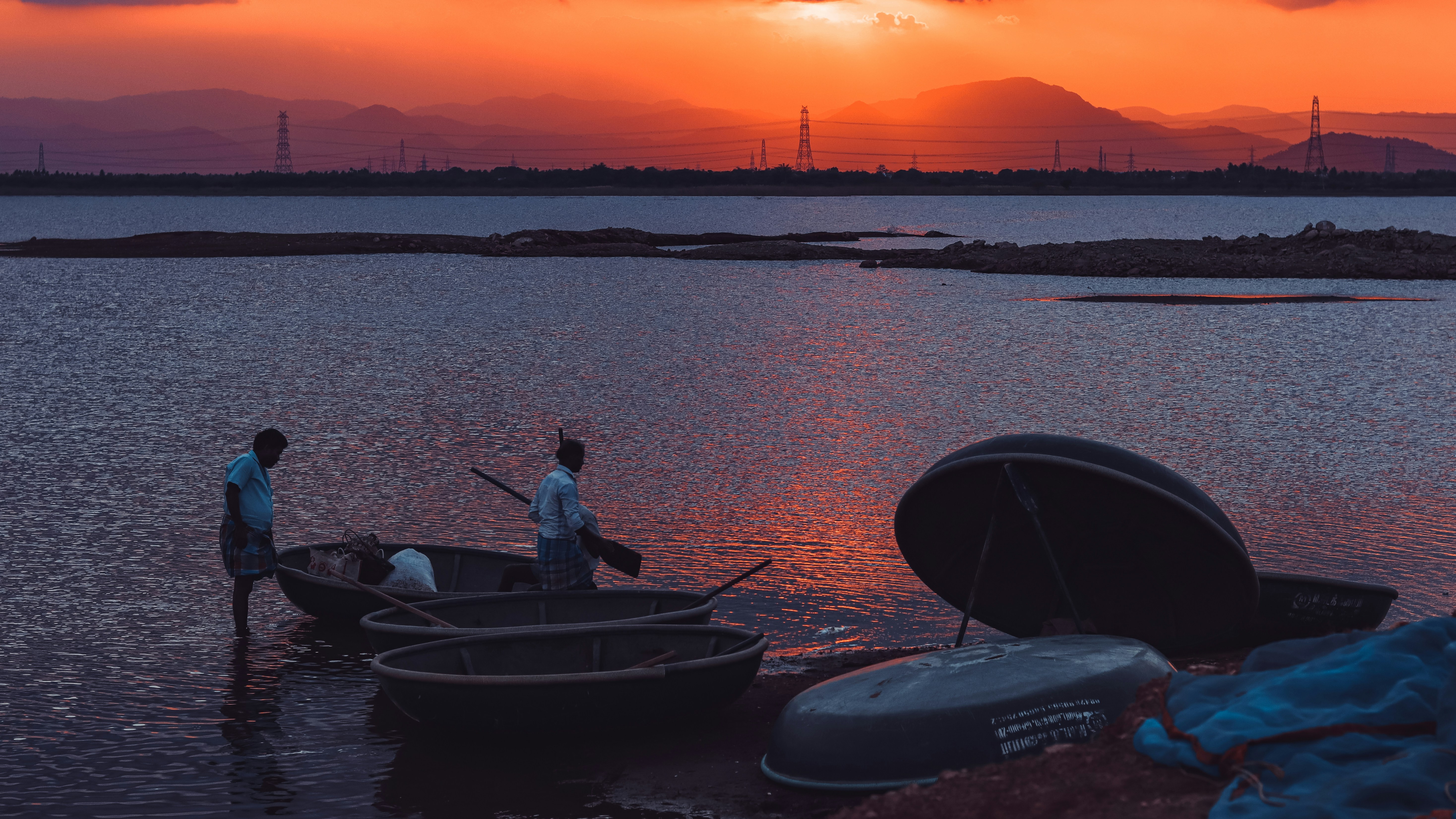 Silhouettes at Sundown: Boats Rest on a Quiet Tidal Basin