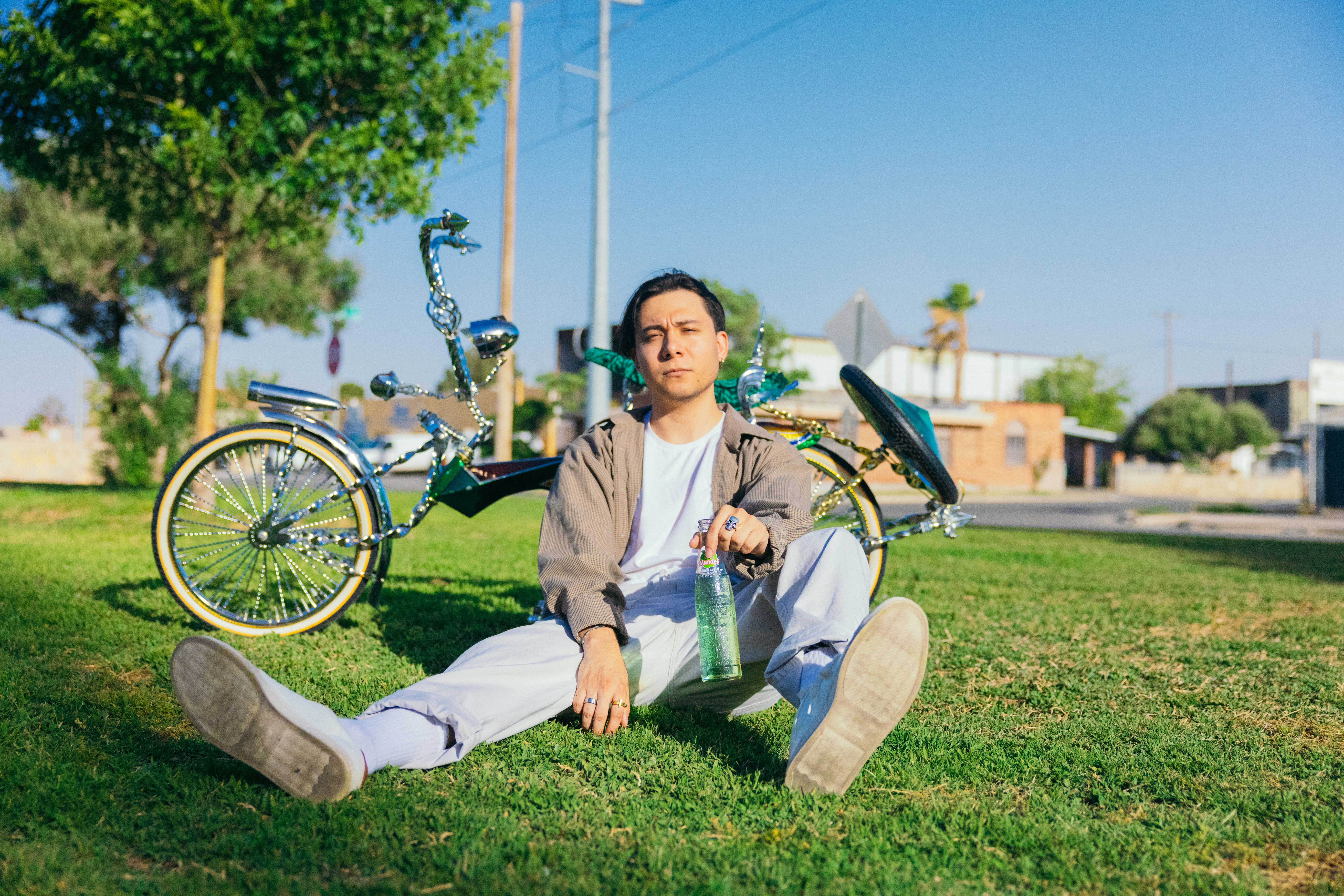 Chill Session by the Park: Cyclist's Break in the Grass
