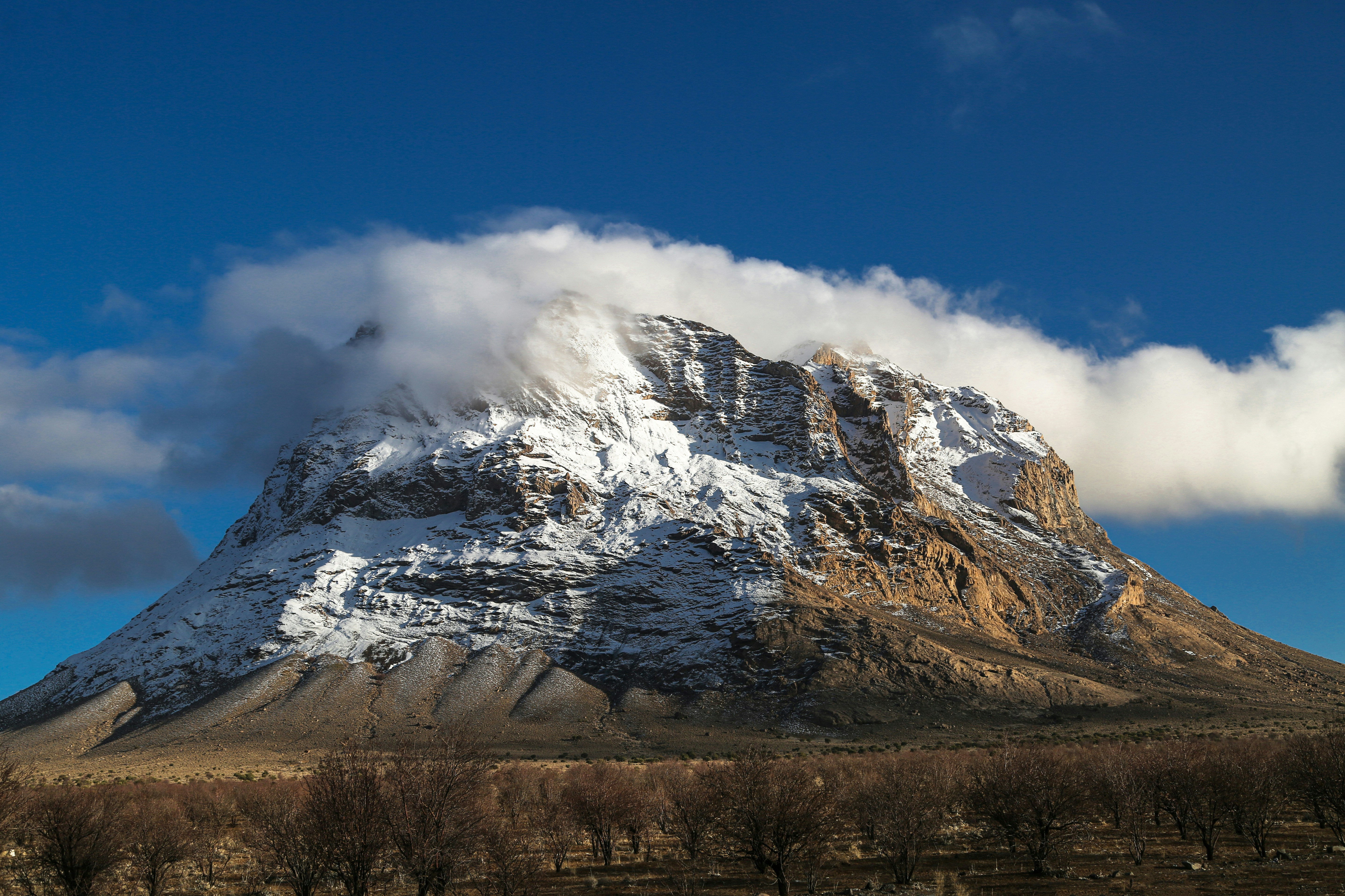 Snow-Kissed Summit Under a Cerulean Sky