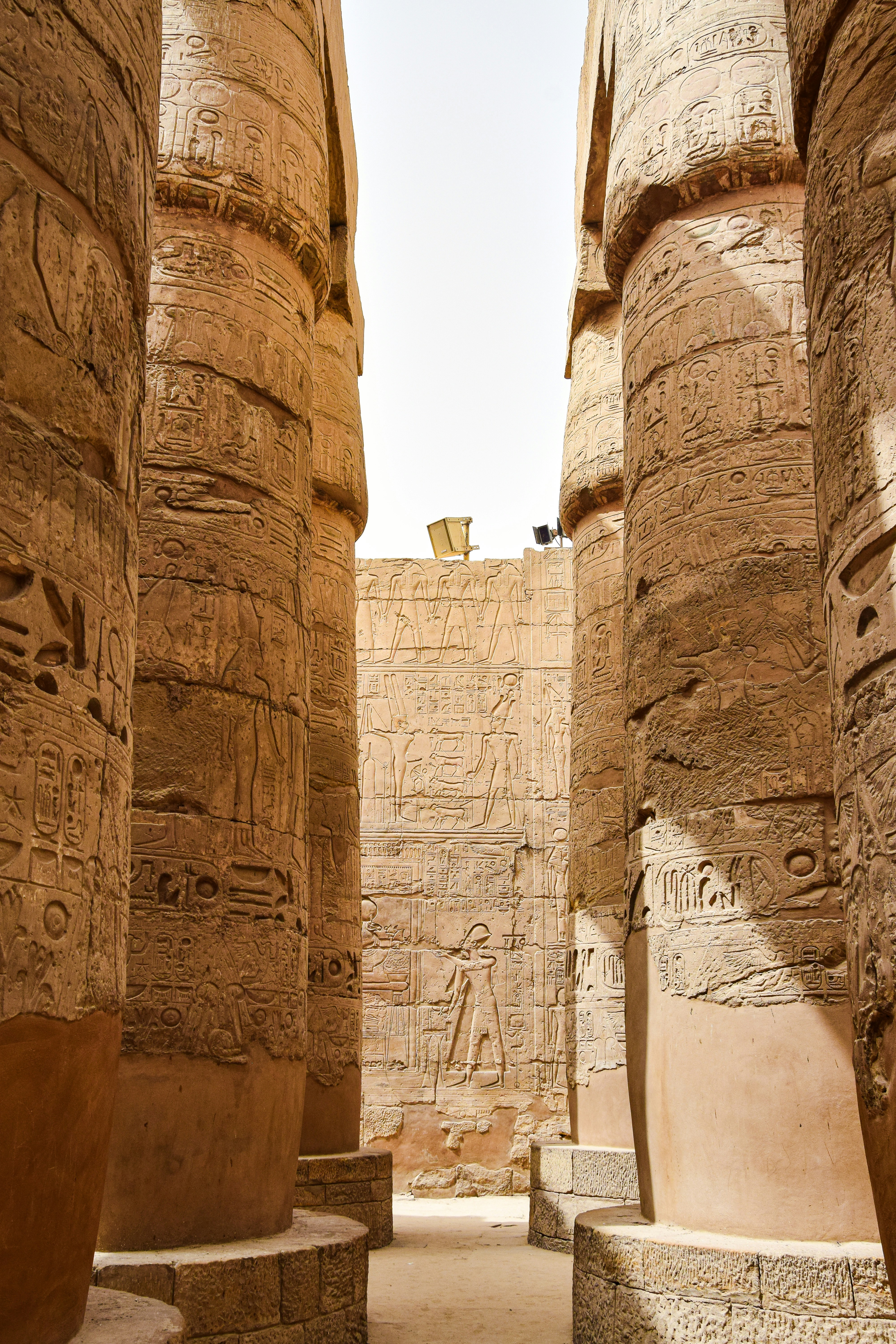 A group of large stone pillars with carvings on them photo – Free Egypt ...