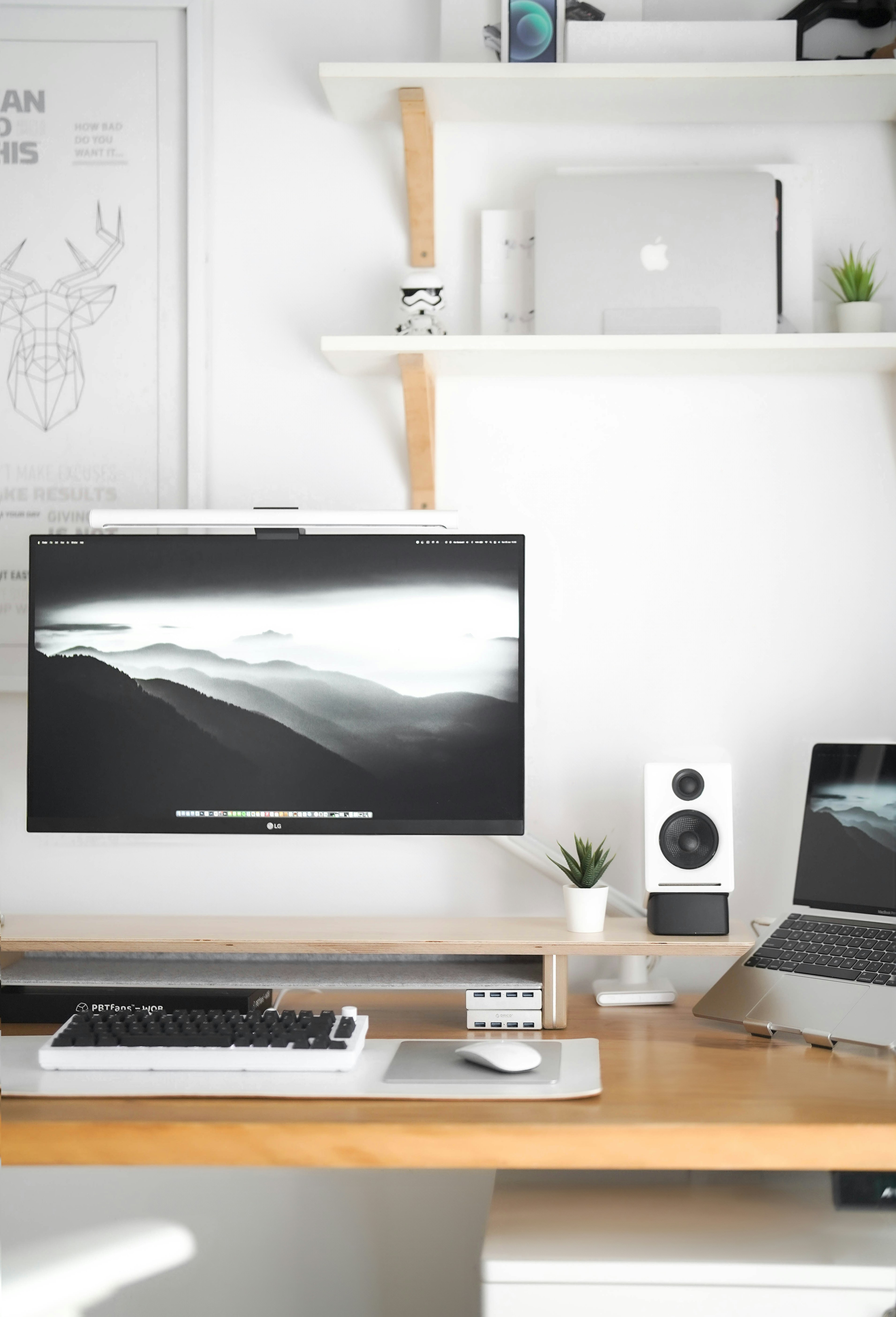 A desk with a laptop and a desktop computer on it photo – Free ...