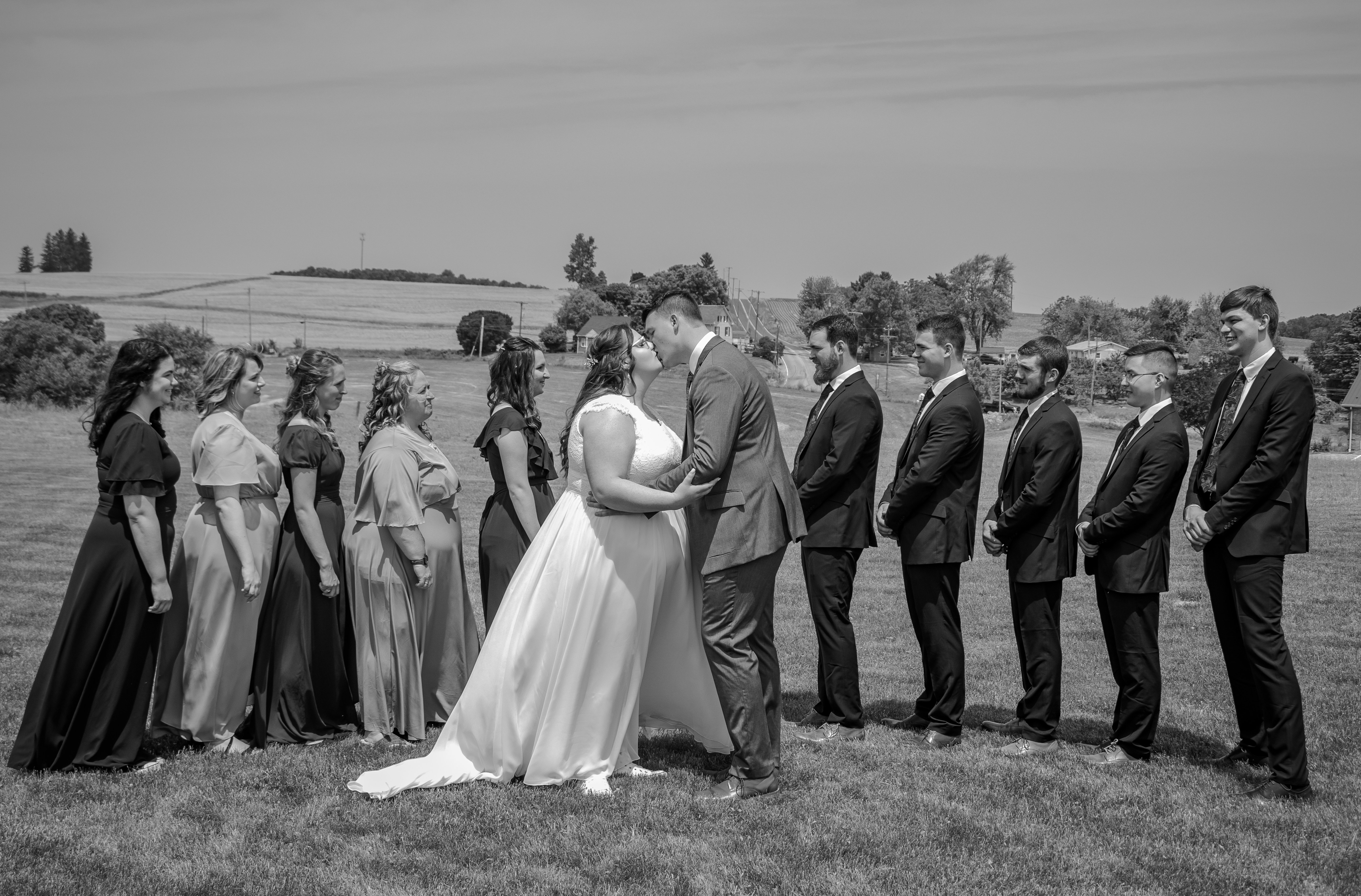 Centerline Vows: The Kiss Framed by a Bridal Party