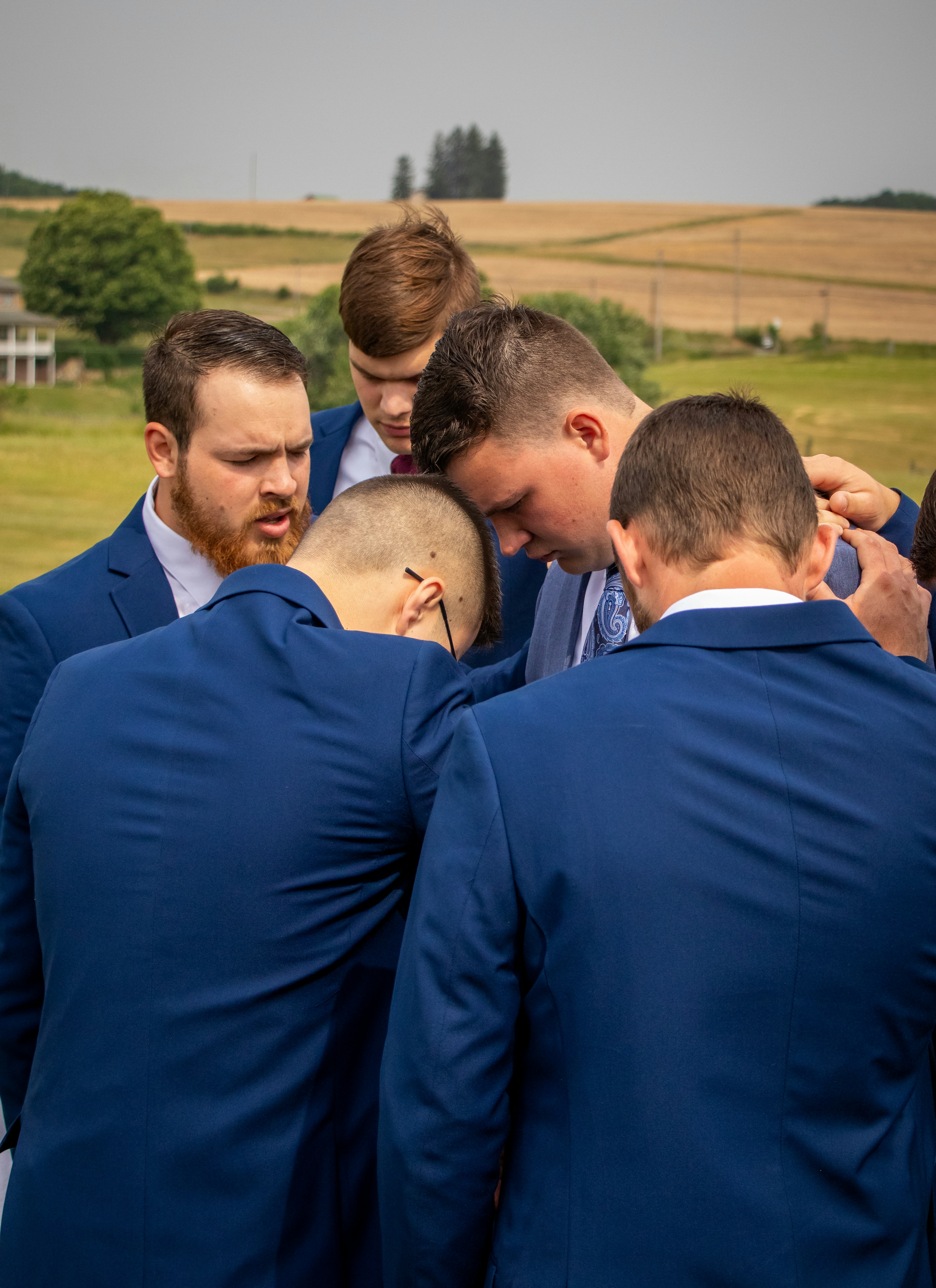 Circle of Blue: A Groomsmen Huddle Before the Vows