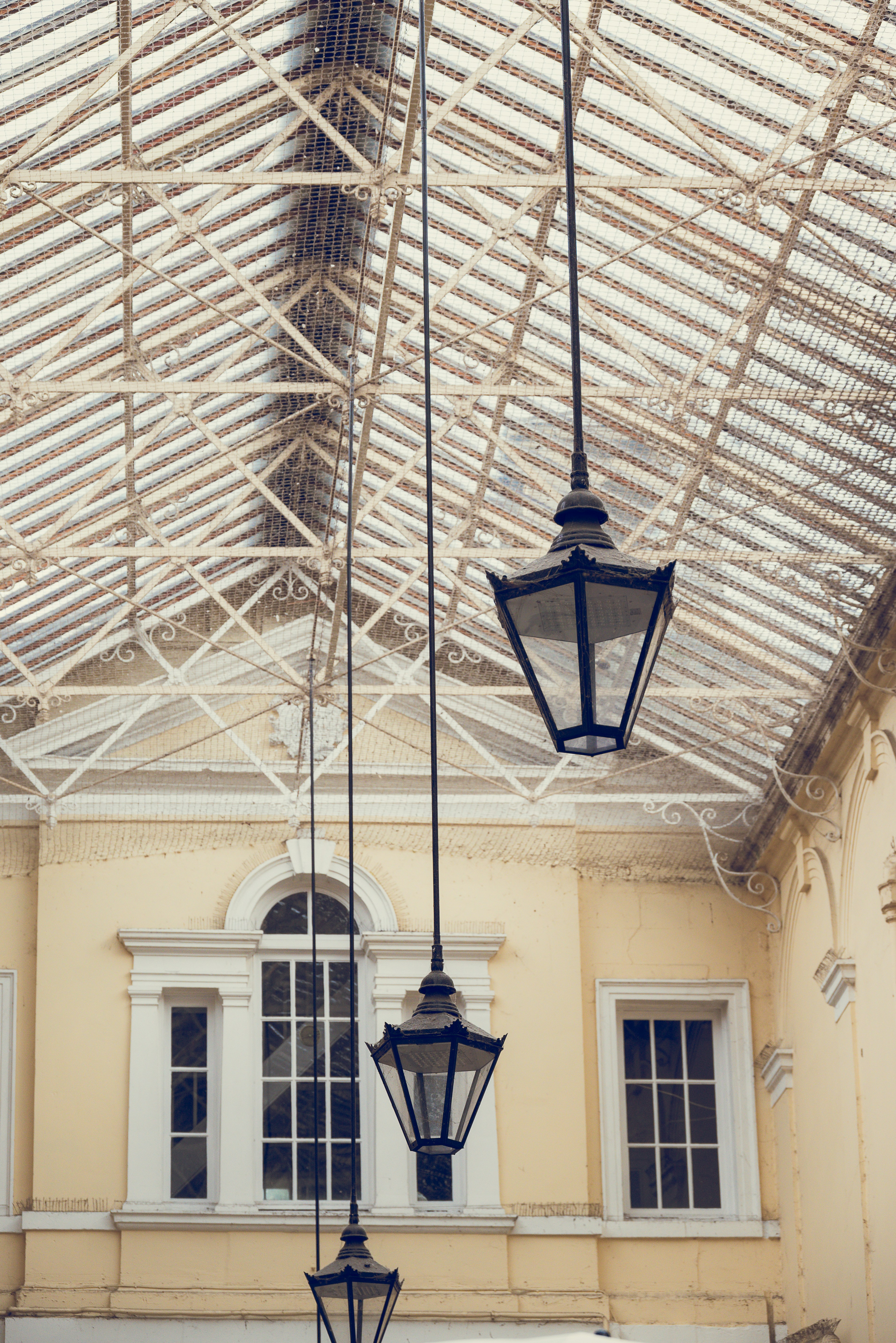 A couple of street lights hanging from a ceiling photo – Free ...
