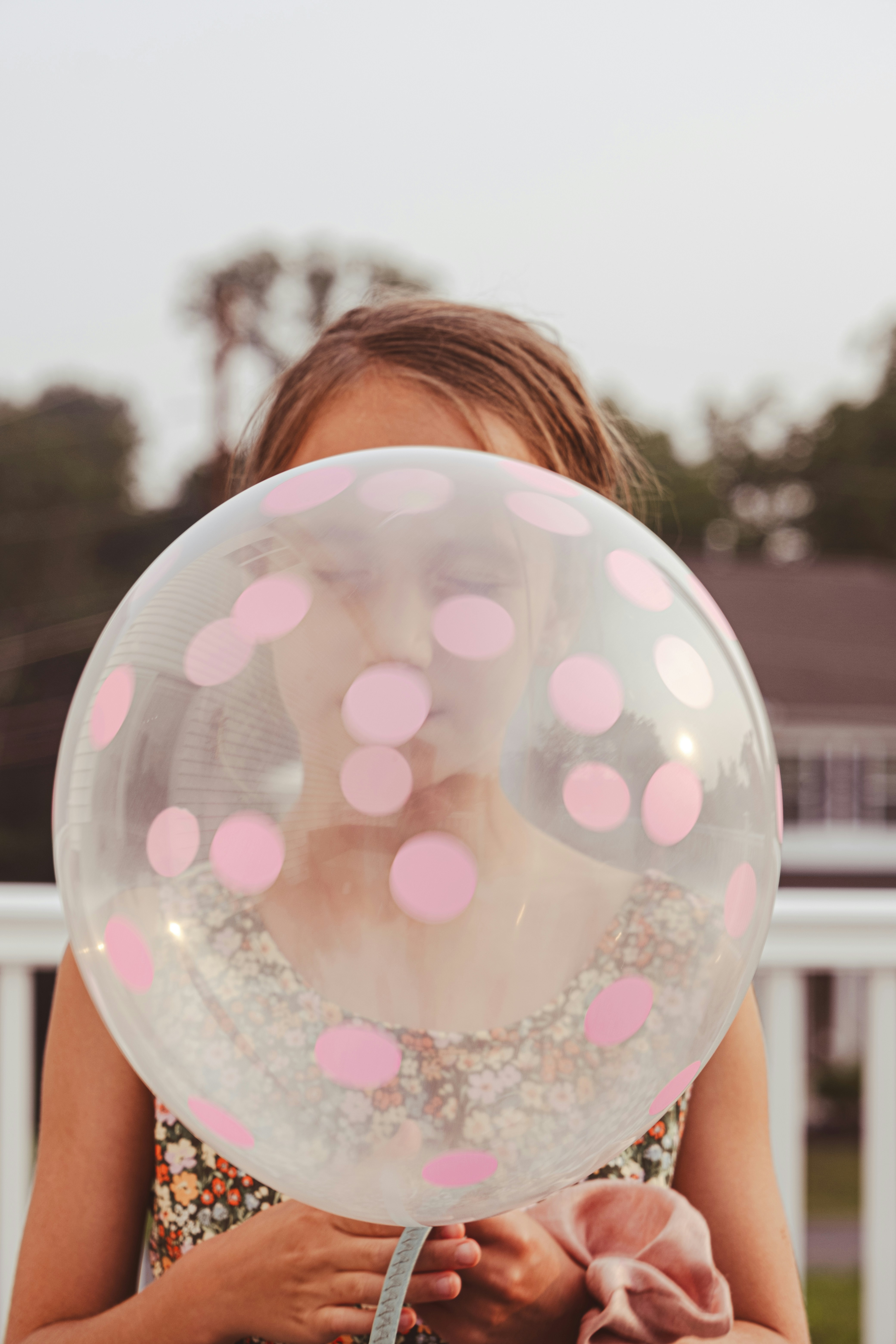 A little girl holding a large bubble ball photo – Free Balloon Image on Unsplash