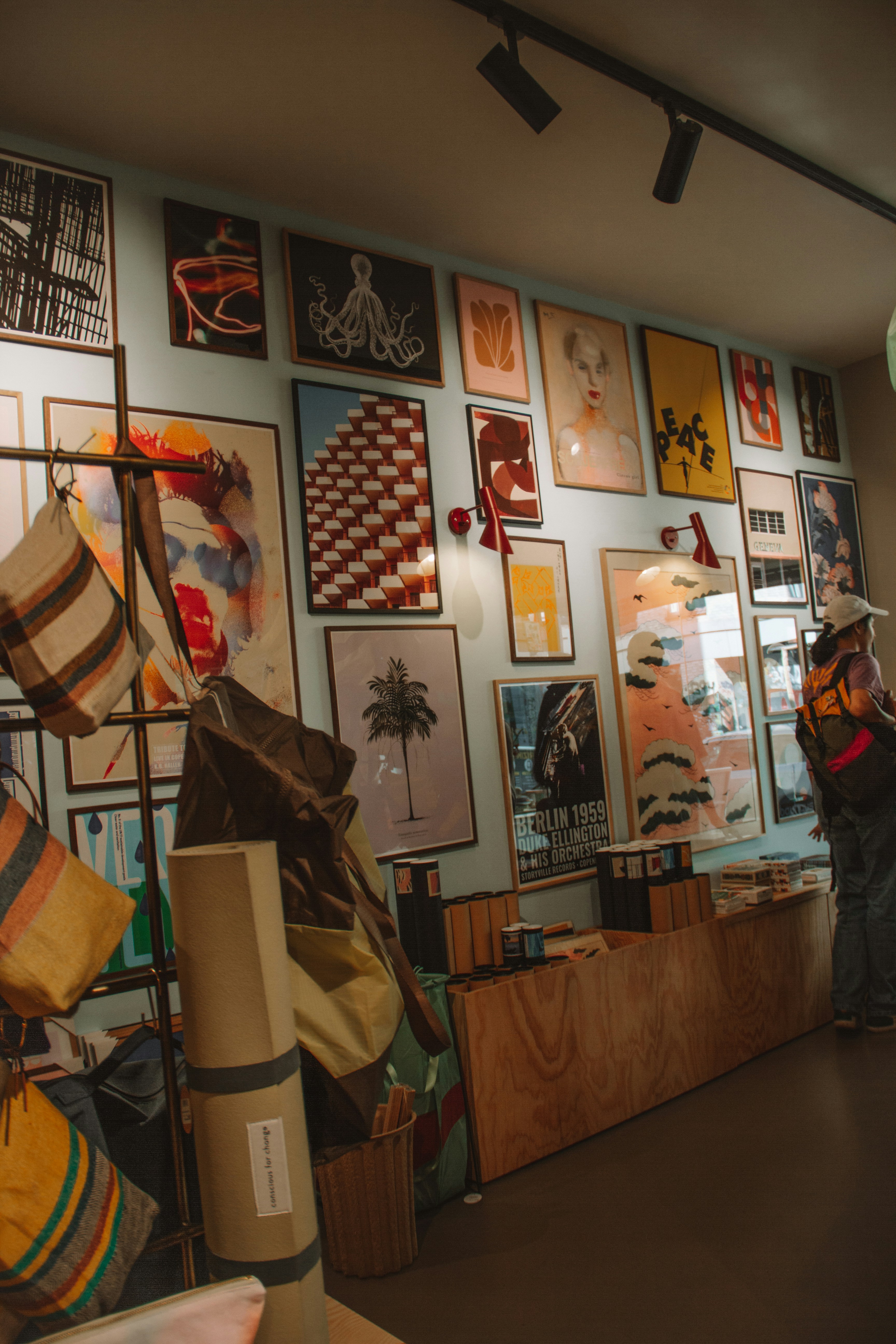 Gallery Wall of Echoes: Framed Stories in a Cozy Shop