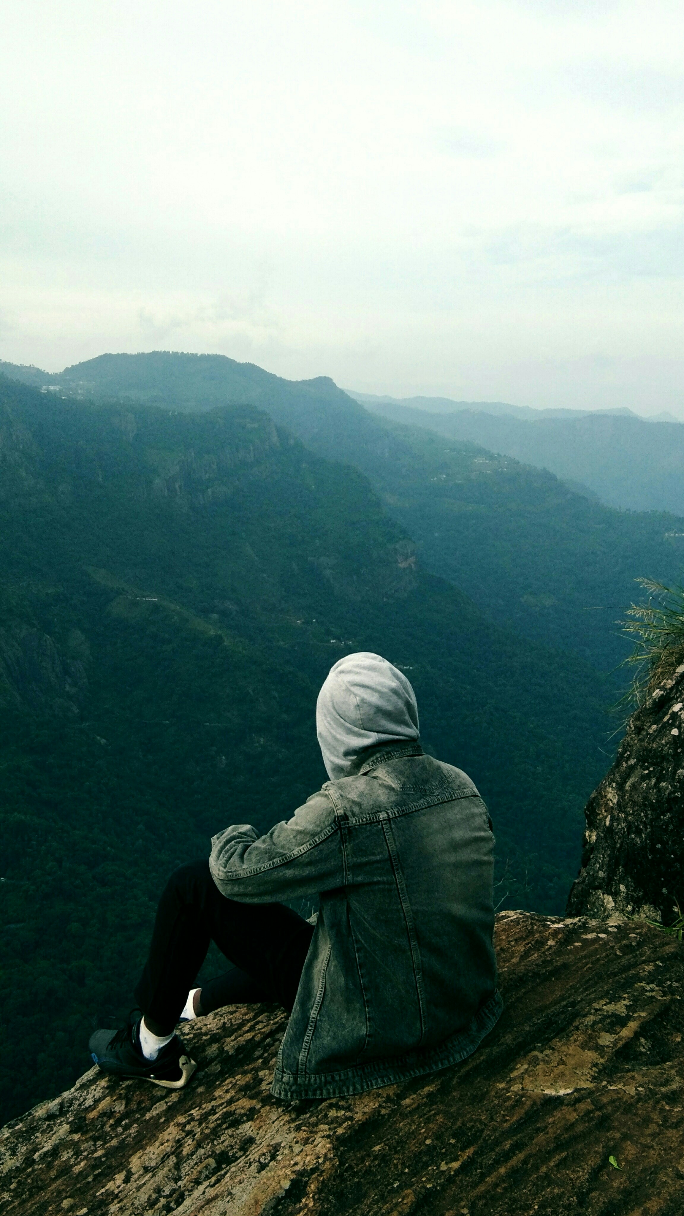 Edge of the World: A Quiet Moment on the Mountain Rim