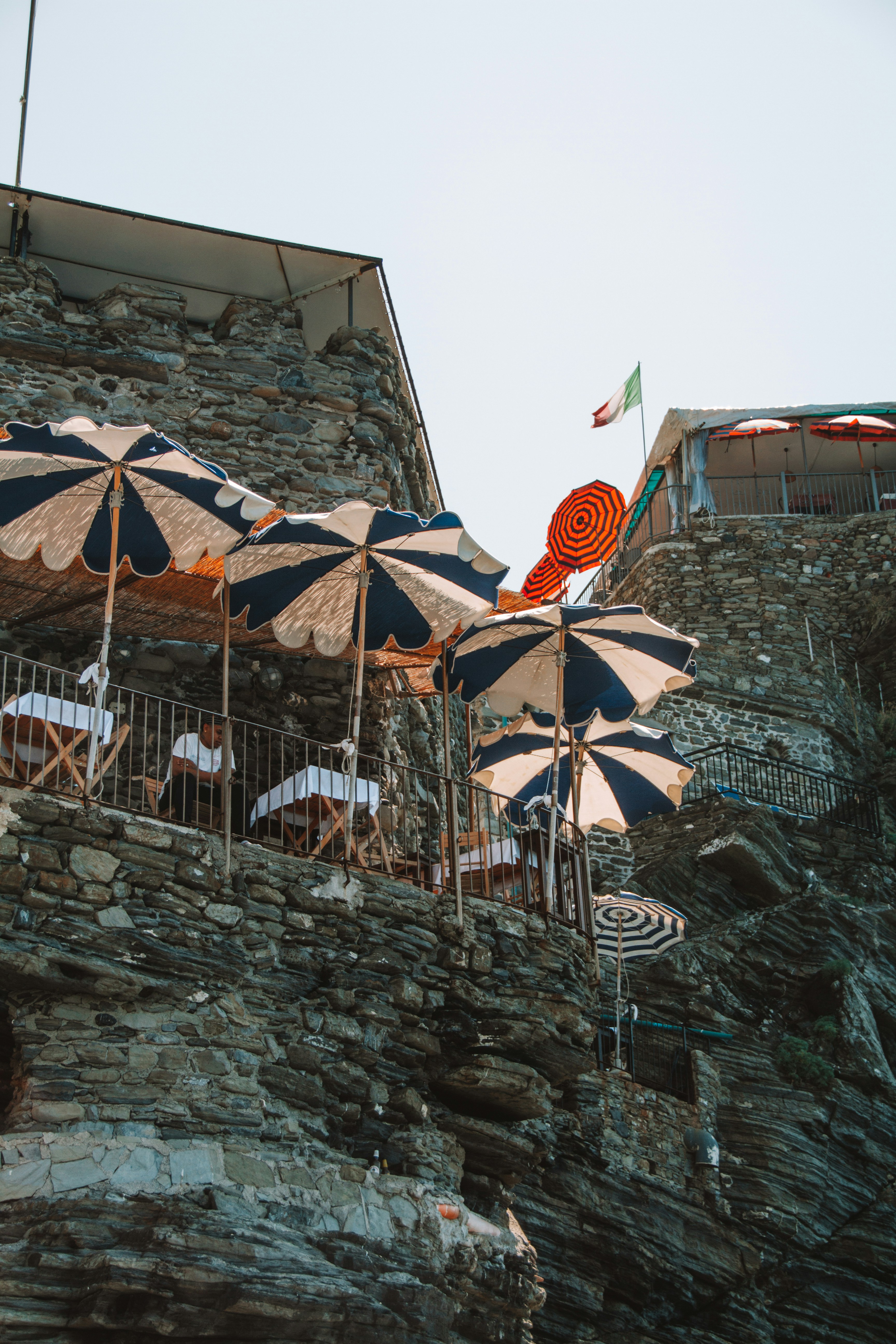 Cliffside Café Under a Patchwork of Stripes