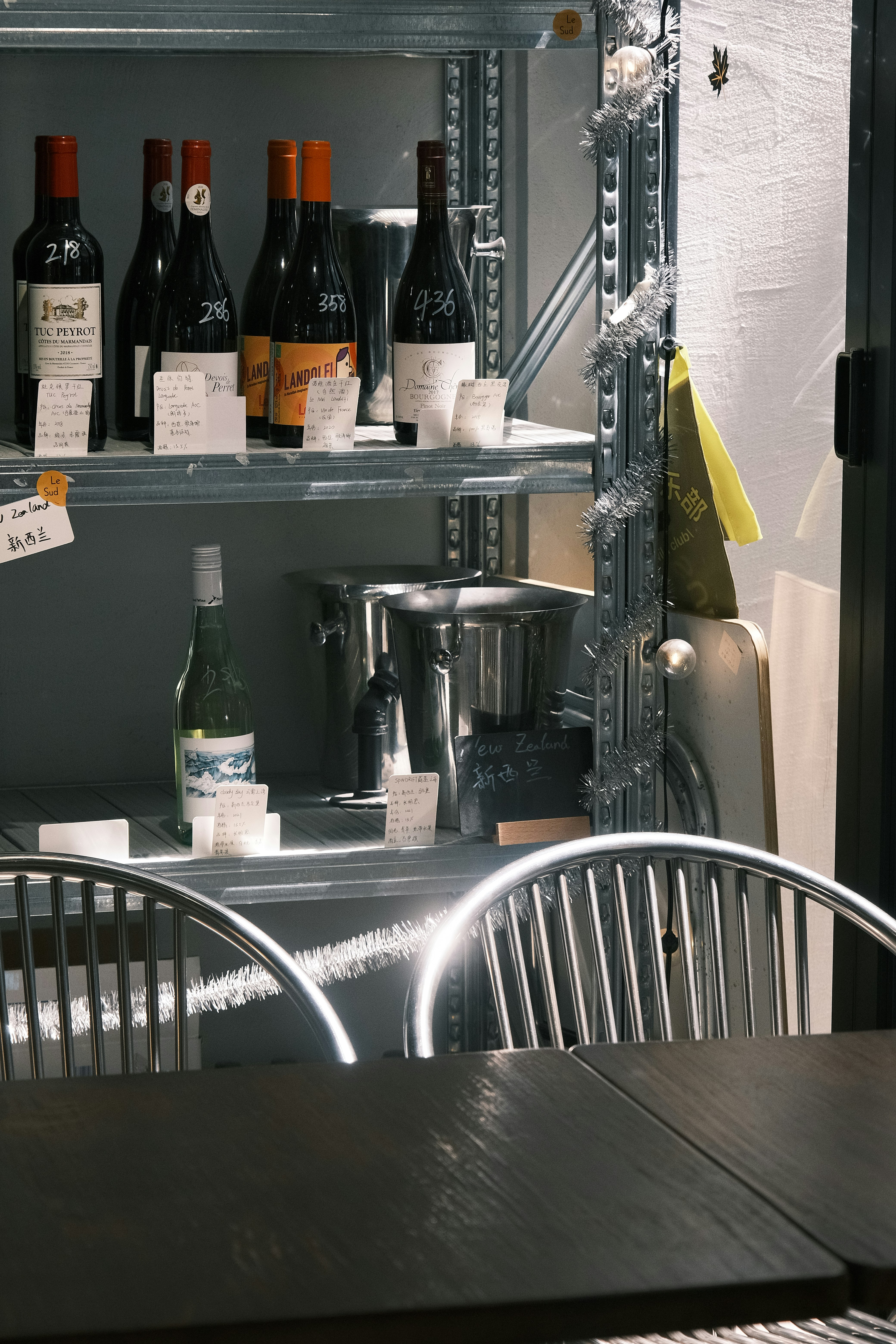 Wine shelf glow: organized bottles and metallic bar setup