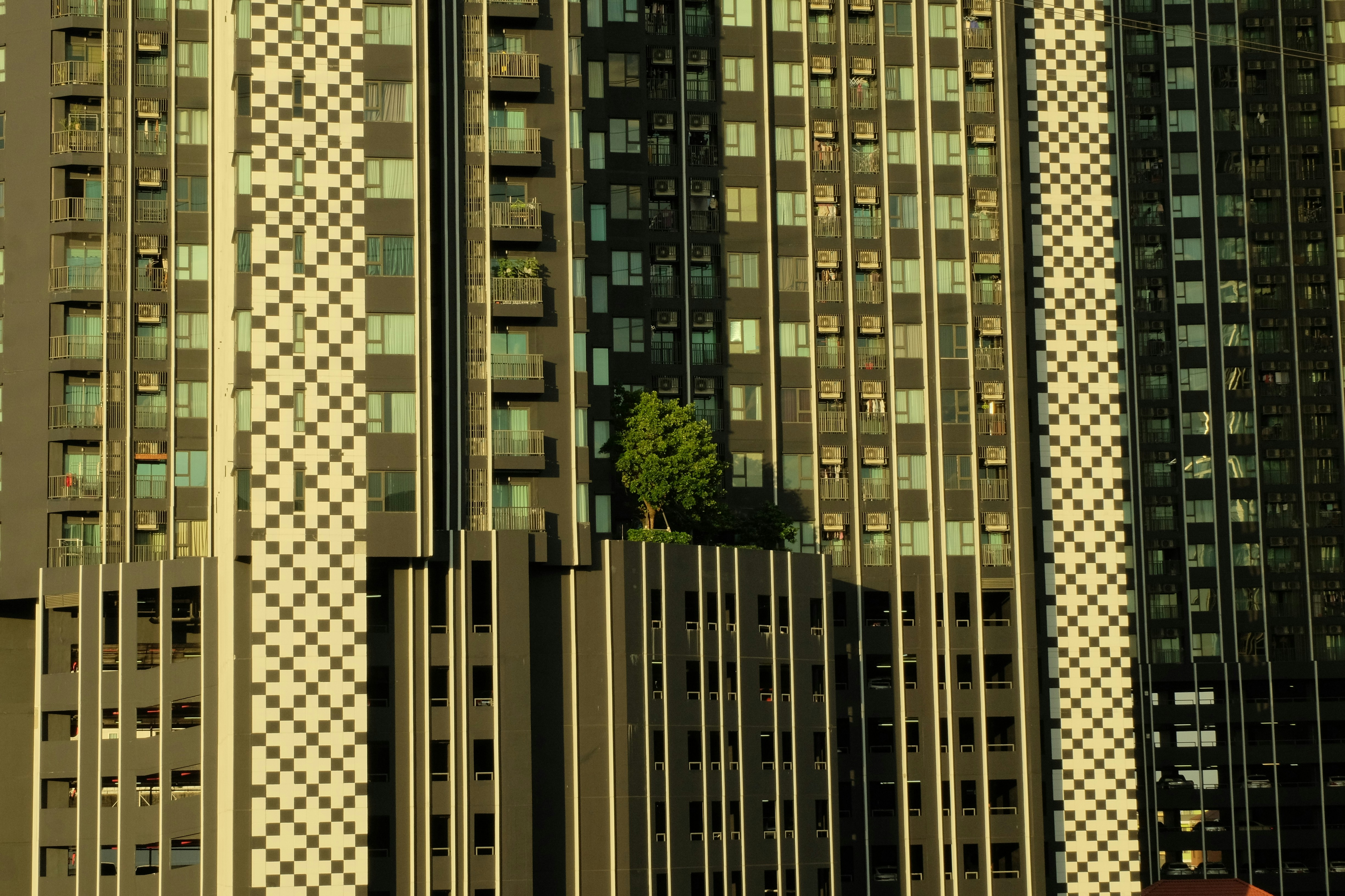 Concrete Facade Chorus: A Vertical Ballet of Patterned Towers