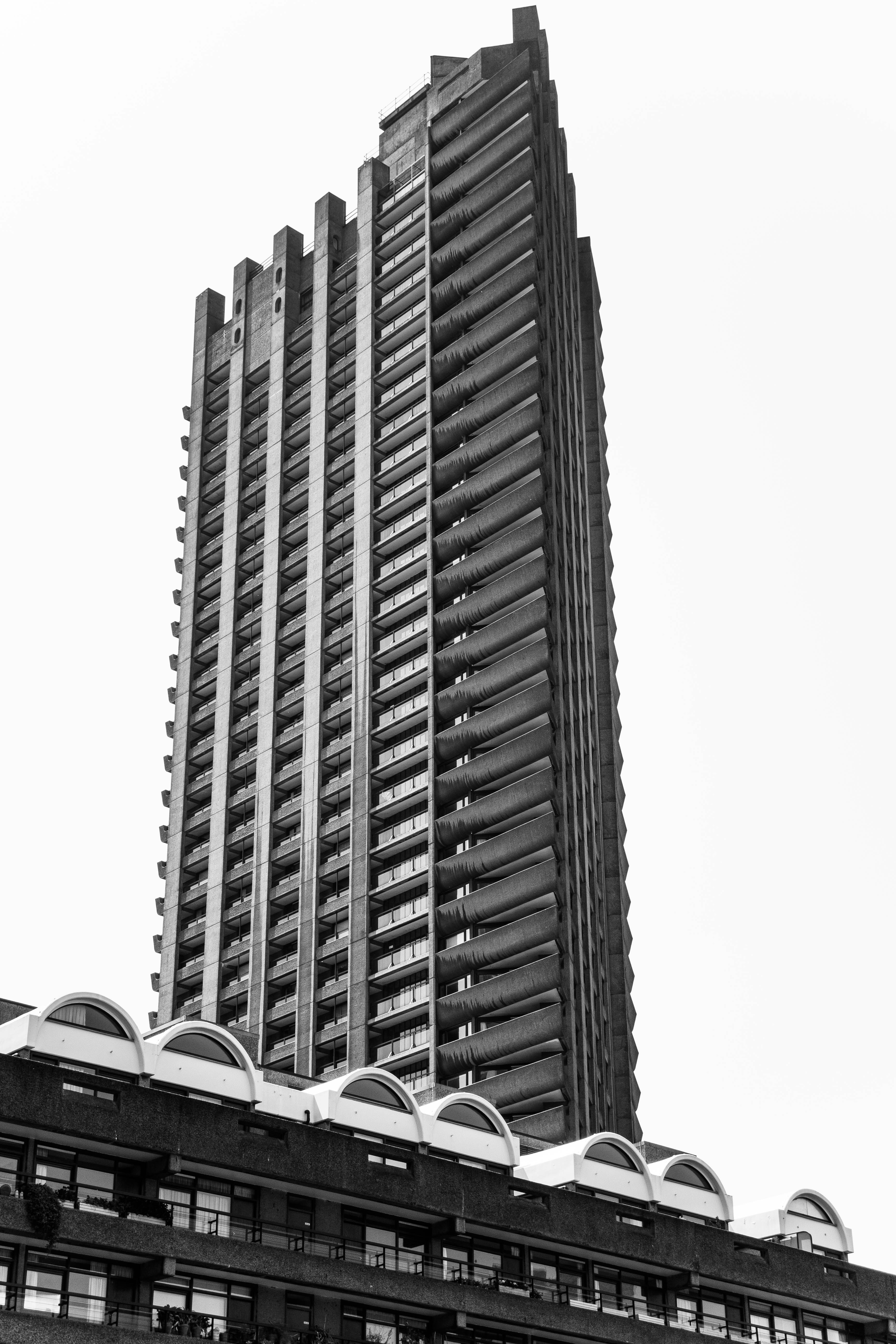 The Barbican Centre, London, UK. | a black and white photo of a tall building