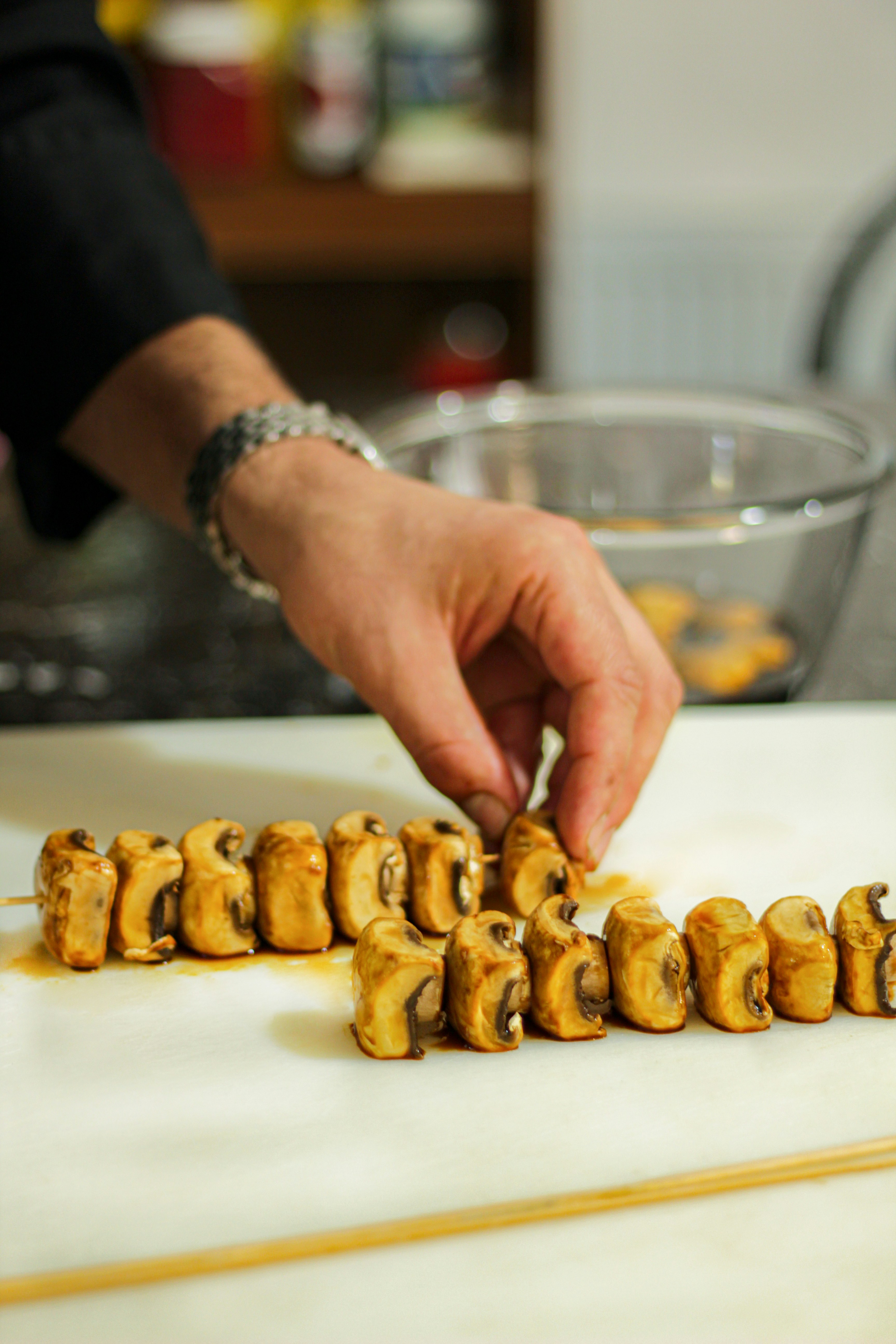 A person cutting up food on a cutting board photo – Free Food Image on ...